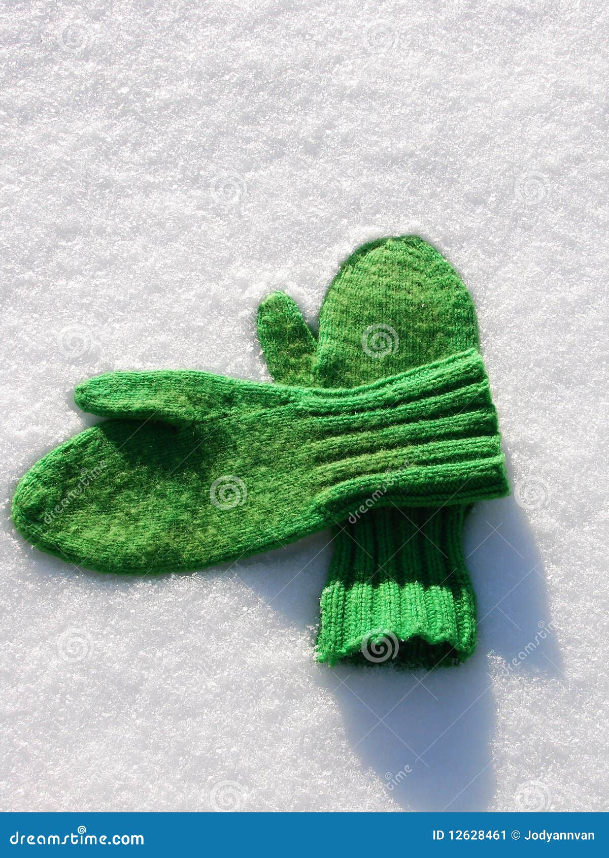 Pair of Green Mittens on Snow Stock Image - Image of mittens, pair ...