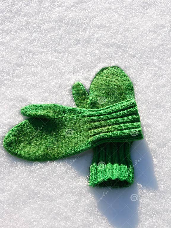 Pair of Green Mittens on Snow Stock Image - Image of mittens, pair ...