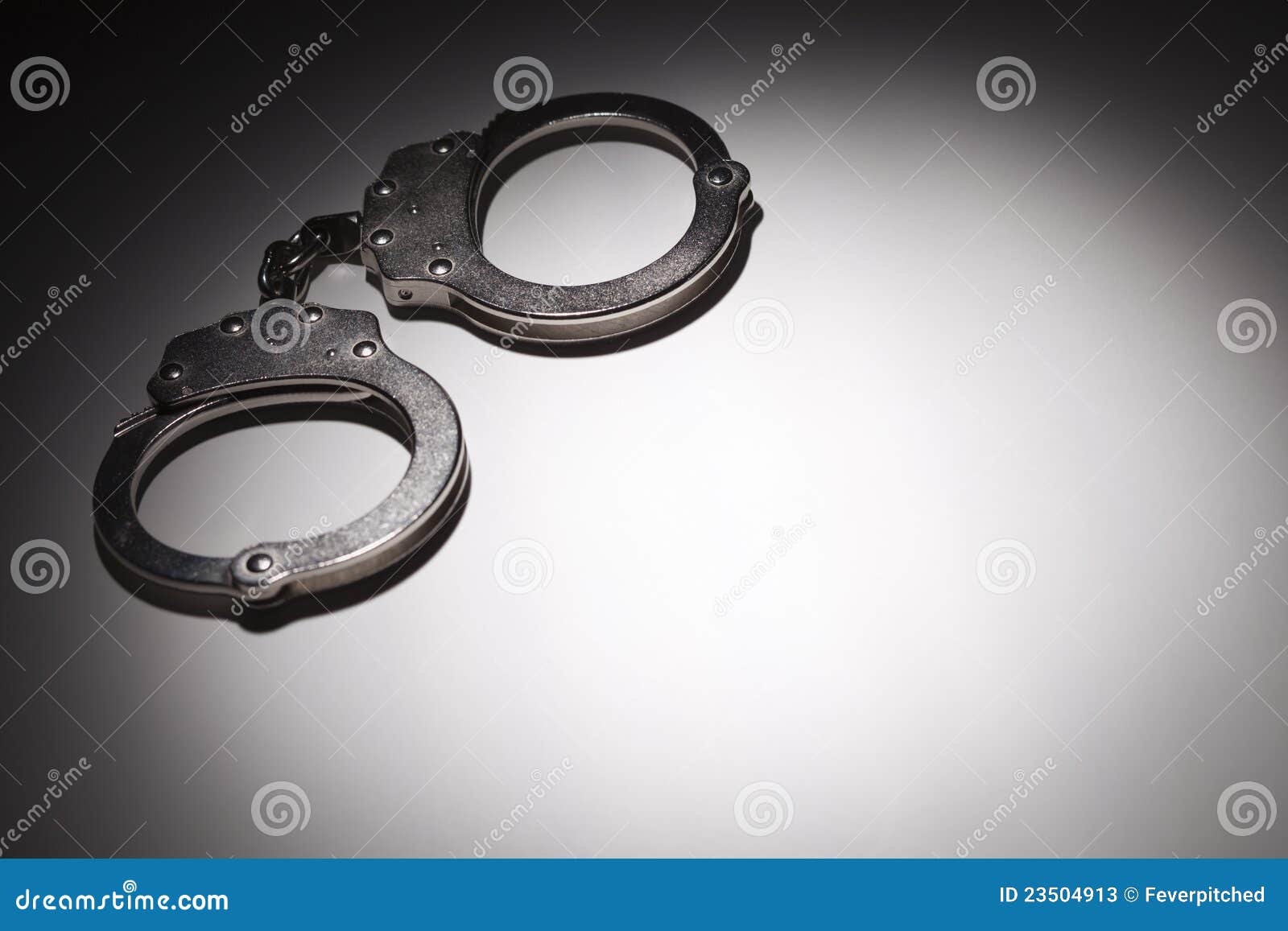 Pair of Handcuffs Under Spot Light - Text Room Stock Image - Image of ...