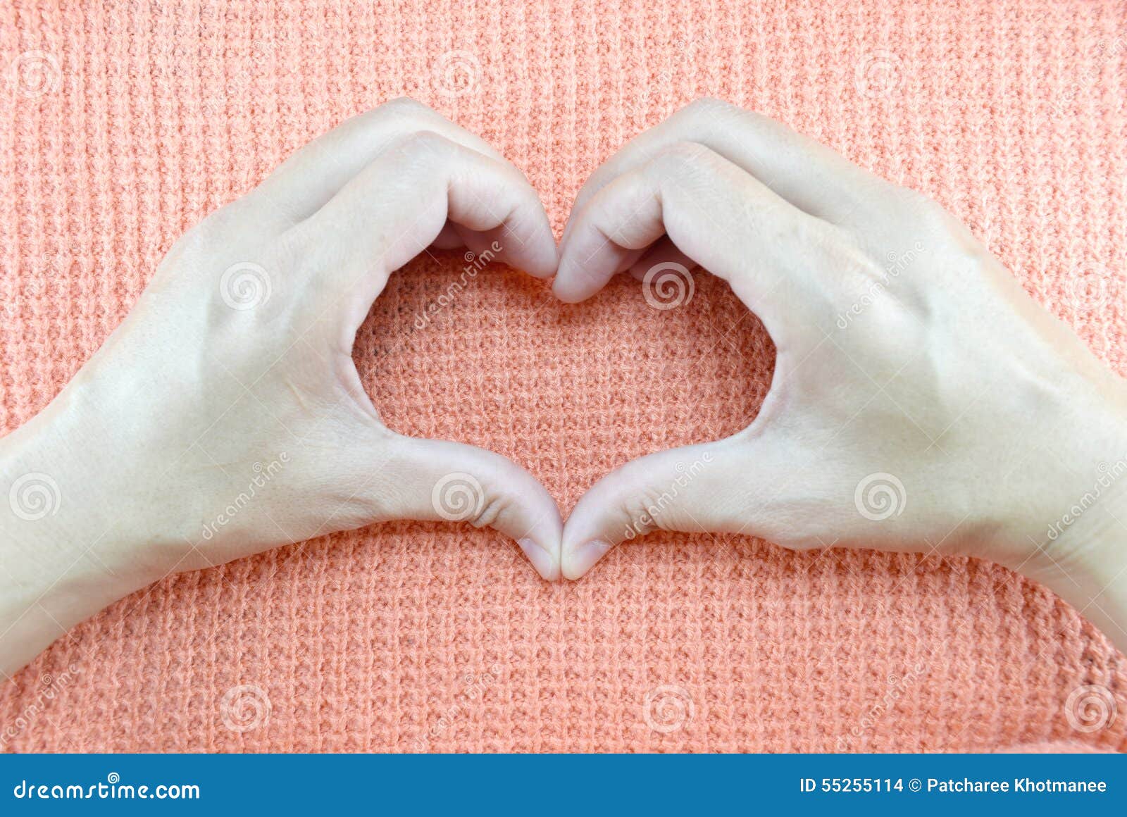 Pair of Hands Creating Heart Shape on Knit Fabric Background Stock ...