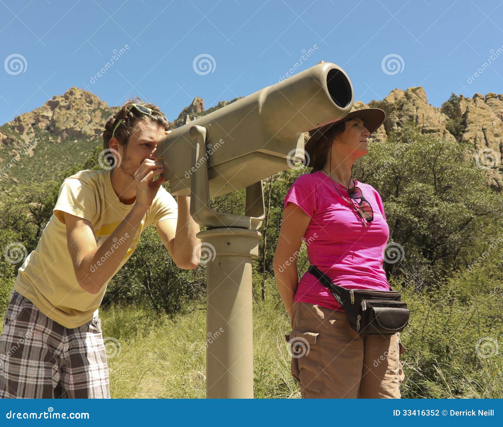 A Pair of Hikers Use a Telescope Stock Photo - Image of study, blue ...