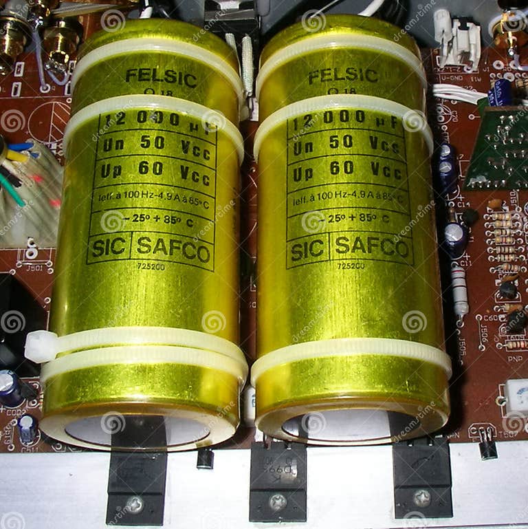 A pair of huge capacitors stock photo. Image of poweramp - 180633906