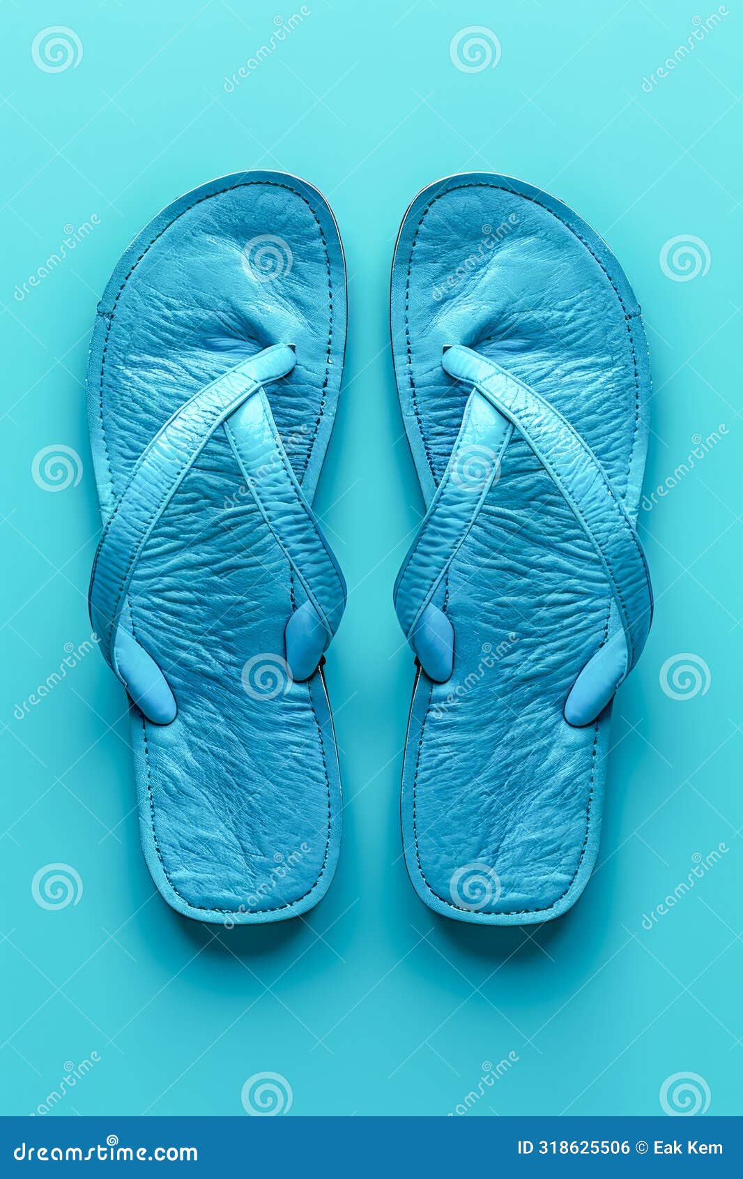 Pair of Light Blue Flip Flops on a Vibrant Blue Background, Top View ...