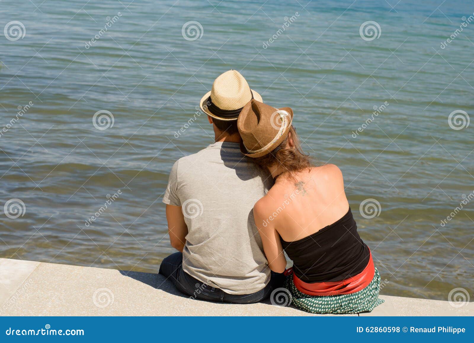 Pair of Lovers Sitting at the Water S Edge Stock Photo - Image of ...