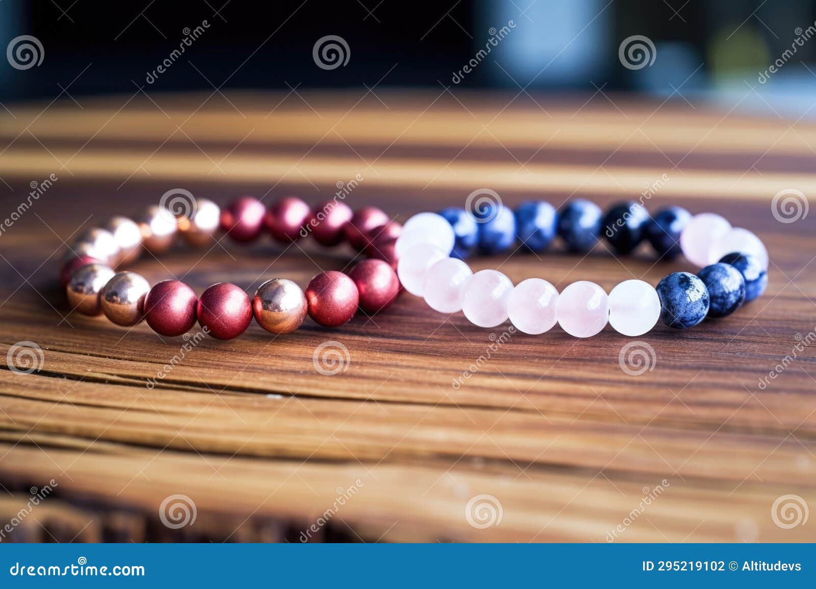 A Pair of Matching Bracelets on a Table Stock Photo - Image of jewelry ...