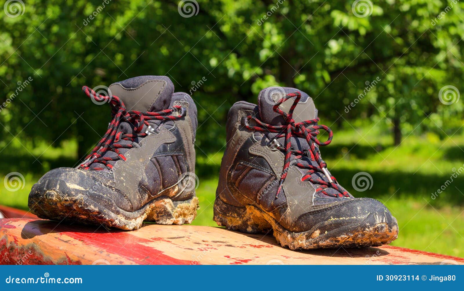 Pair of muddy boots stock photo. Image of trekking, green - 30923114