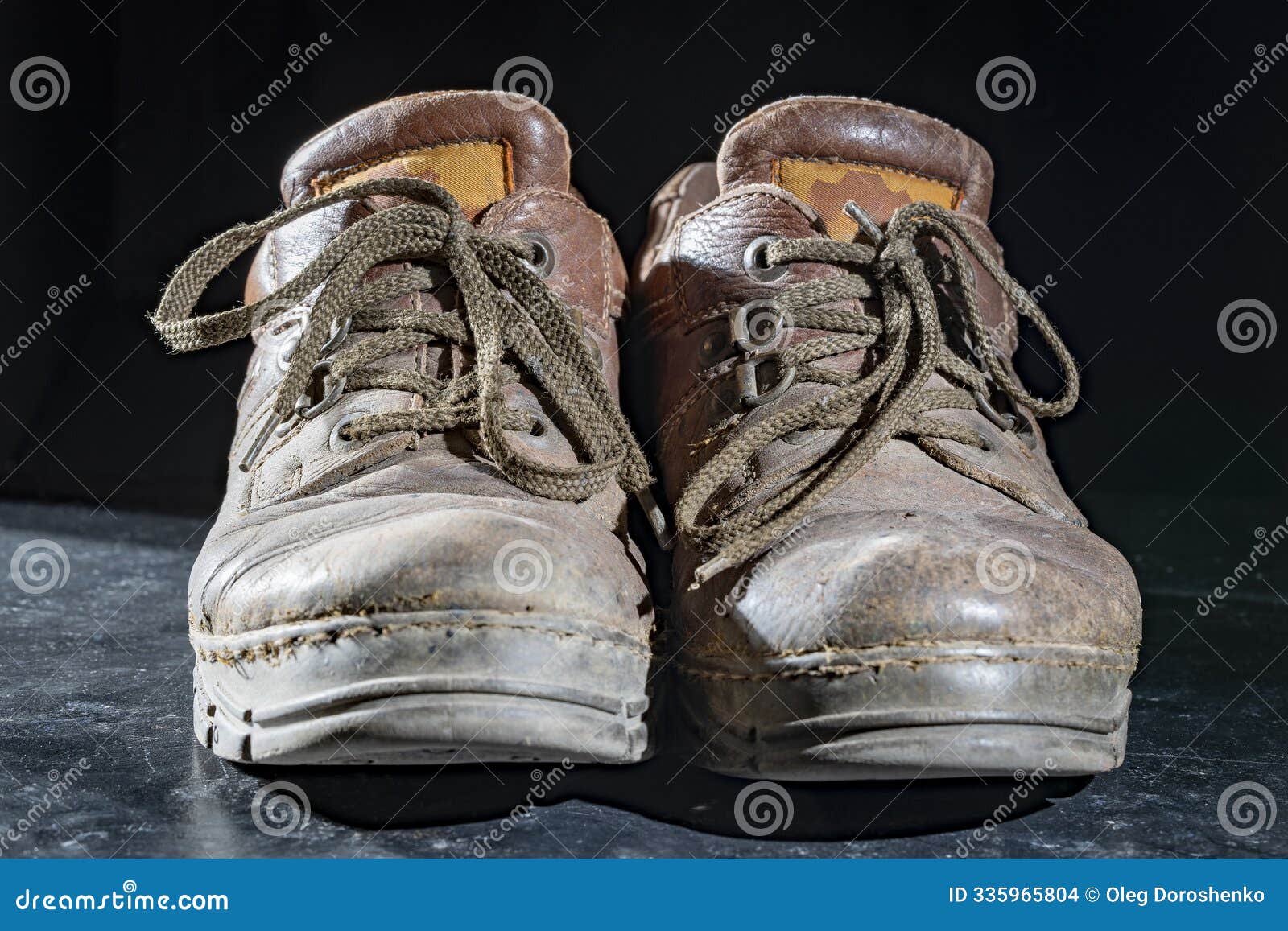 Pair of Old Worn Work Boots on a Black Background, Closeup Stock Photo ...