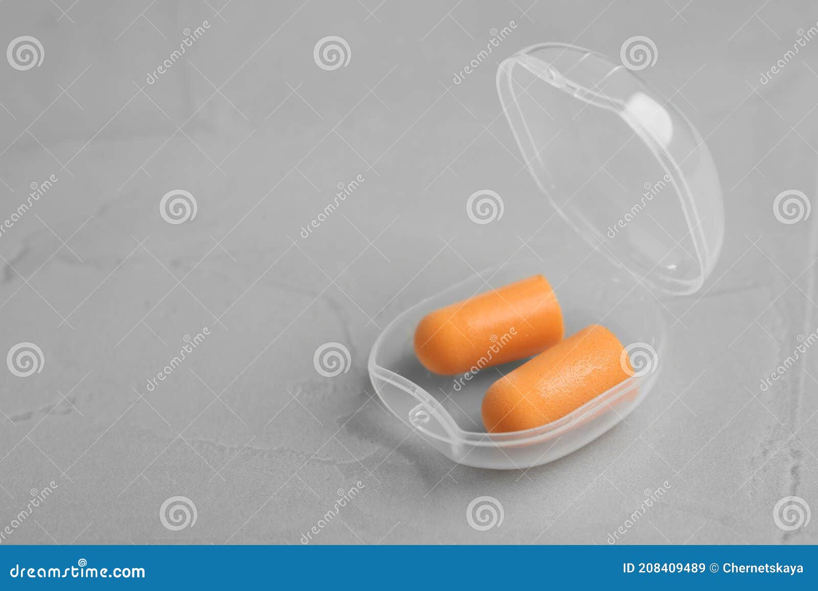 Pair of Orange Ear Plugs in Case on Grey Background. Space for Text ...