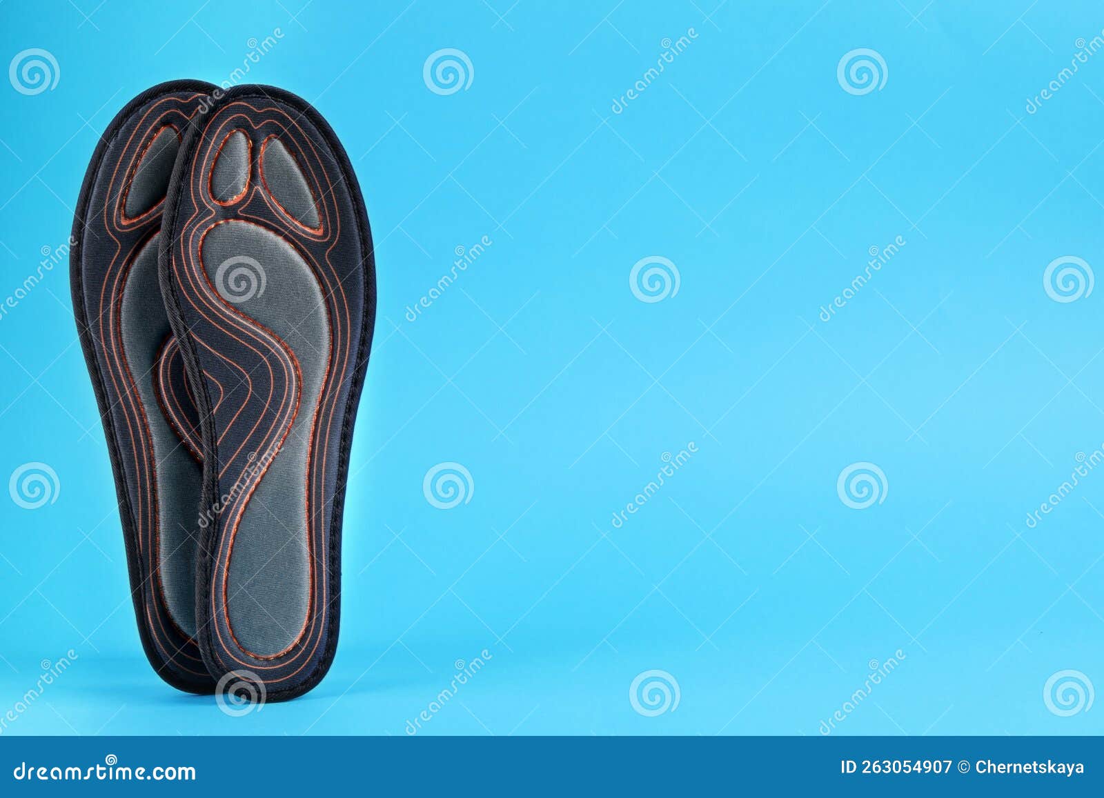 Pair of Orthopedic Insoles on Light Blue Background, Space for Text ...
