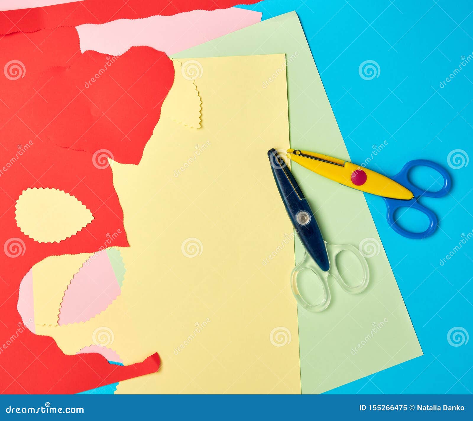 Pair of Plastic Scissors and Colored Paper for Cutting Figures Stock ...