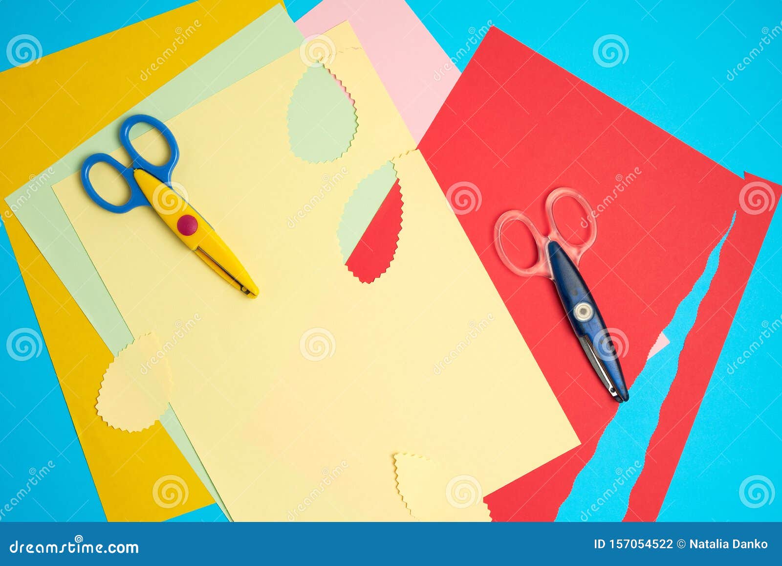 Pair of Plastic Scissors and Colored Paper for Cutting Figures Stock ...