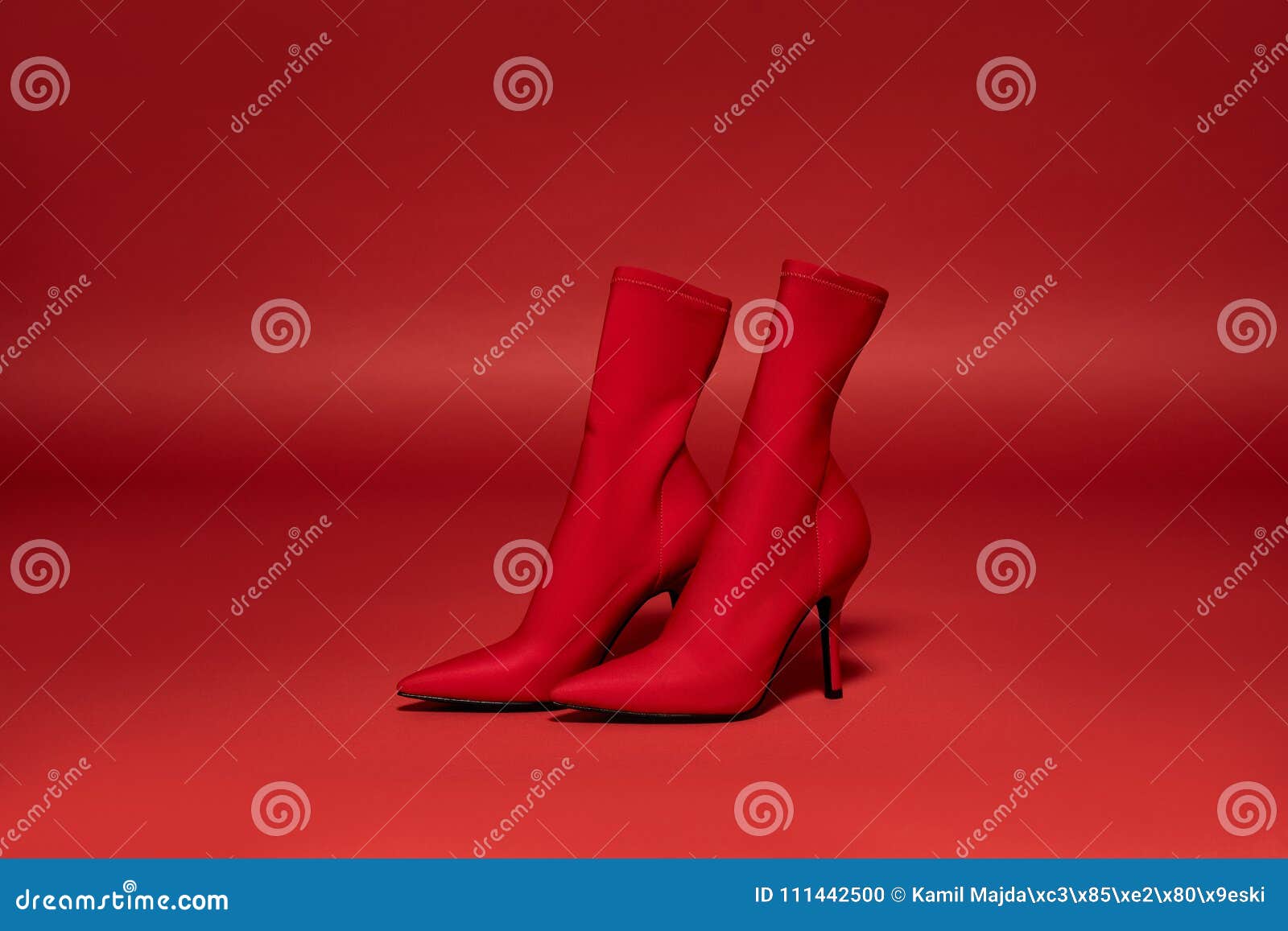 Pair of Red High-heel Shoes on the Deep Red Background Stock Photo ...