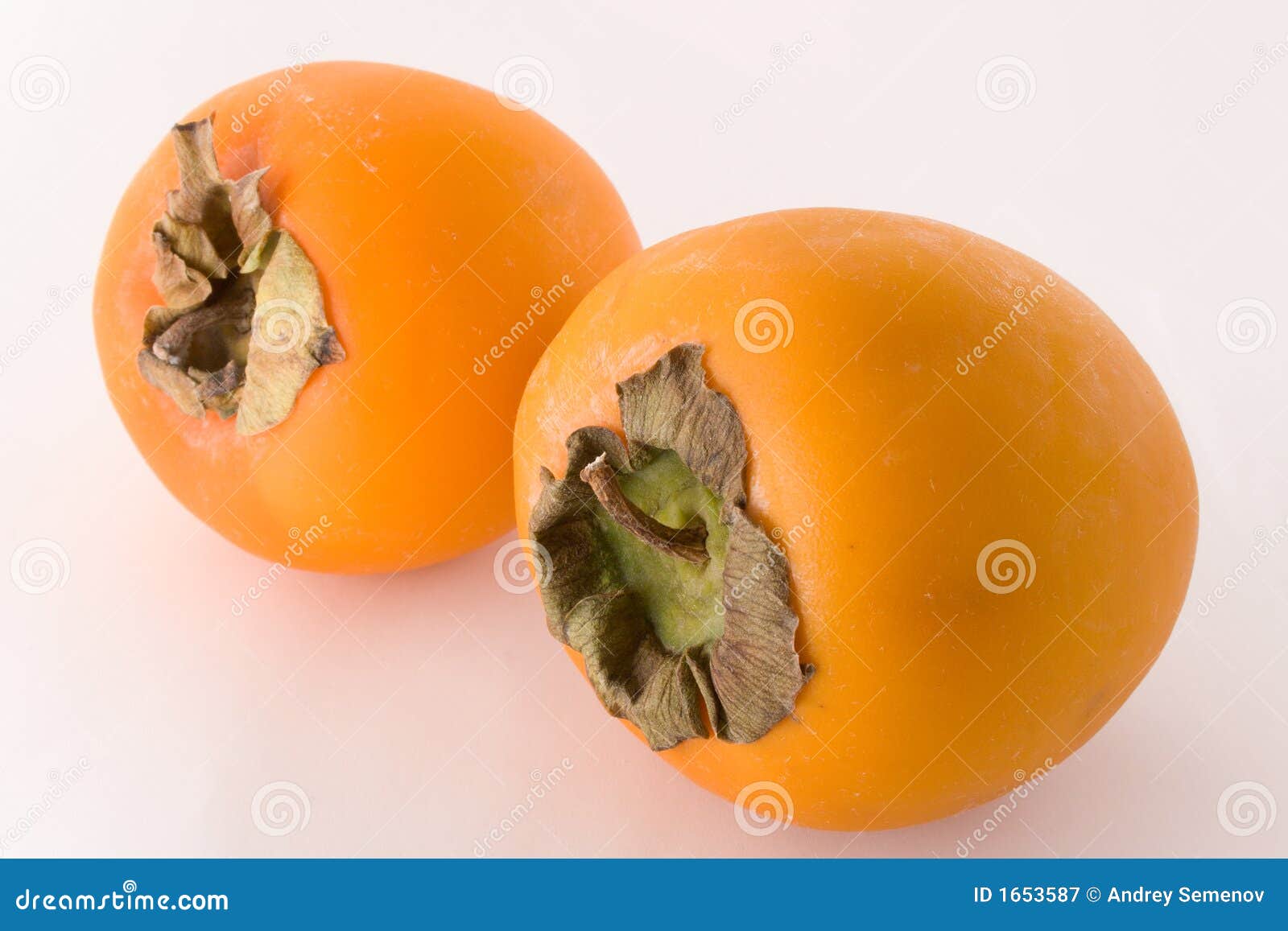Pair of ripe persimmons stock image. Image of natural - 1653587