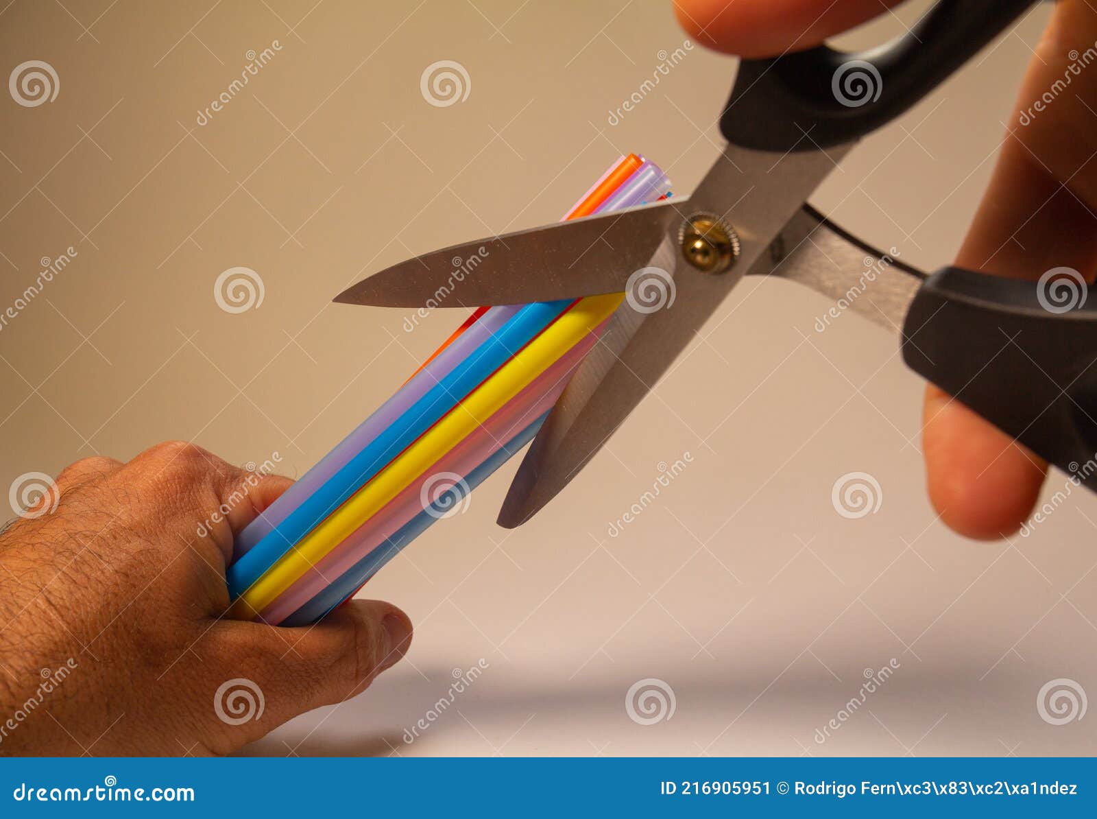 A Pair of Scissors Cutting a Bunch of Plastic Straws. Concept for ...