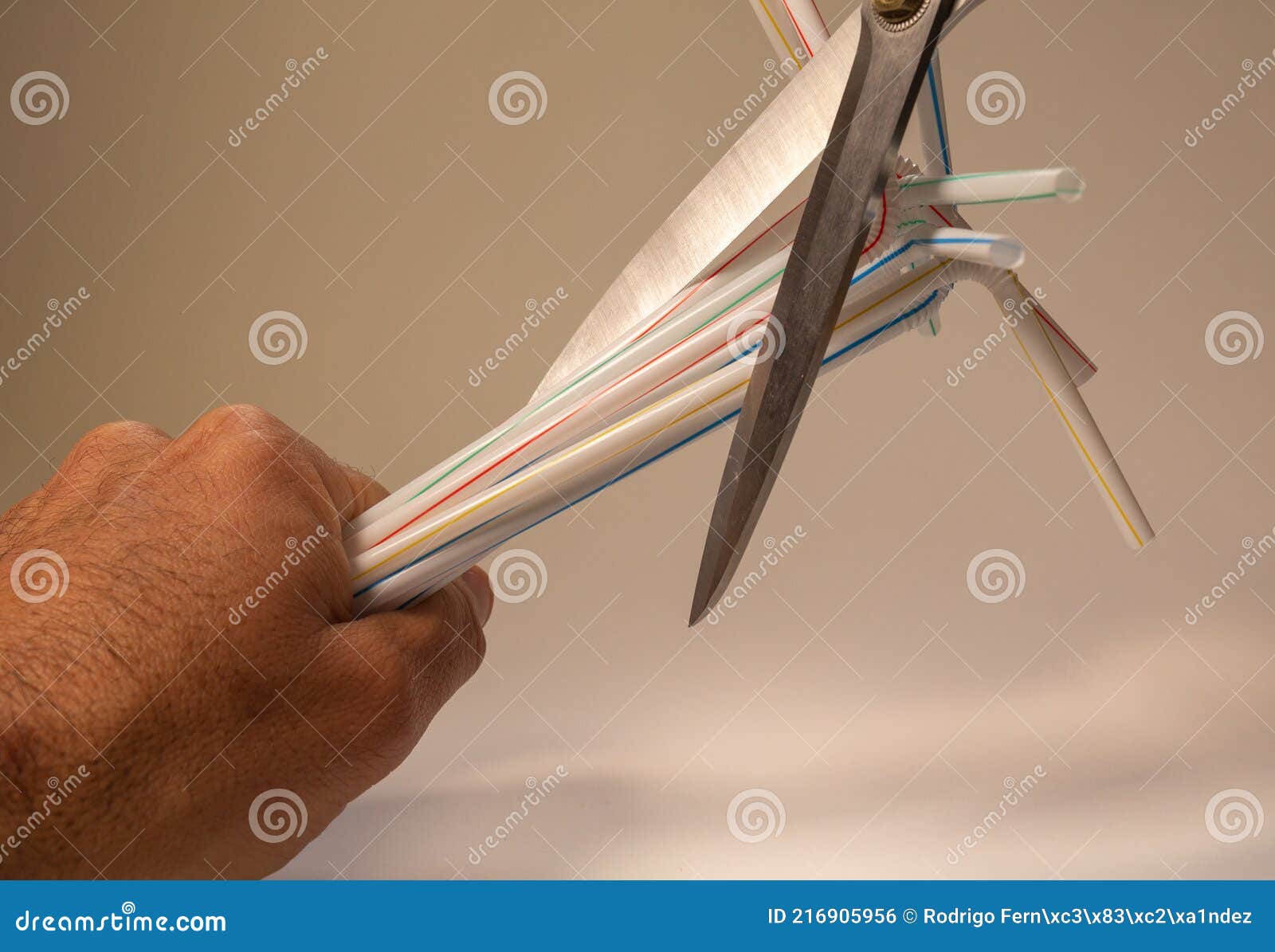 A Pair of Scissors Cutting a Bunch of Plastic Straws. Concept for ...