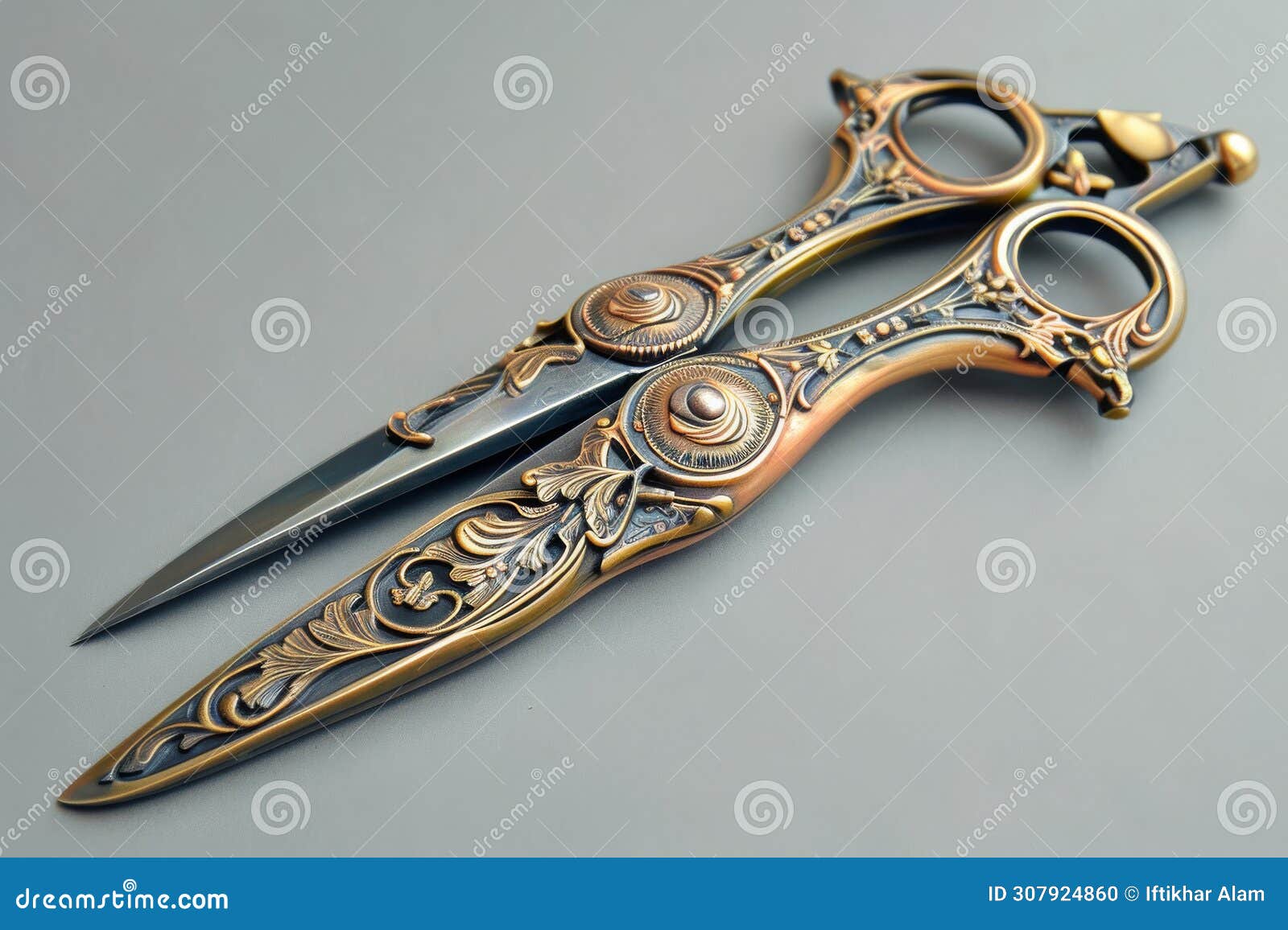 A Pair of Scissors is Seen Resting on a Table Surface, Surrounded by ...