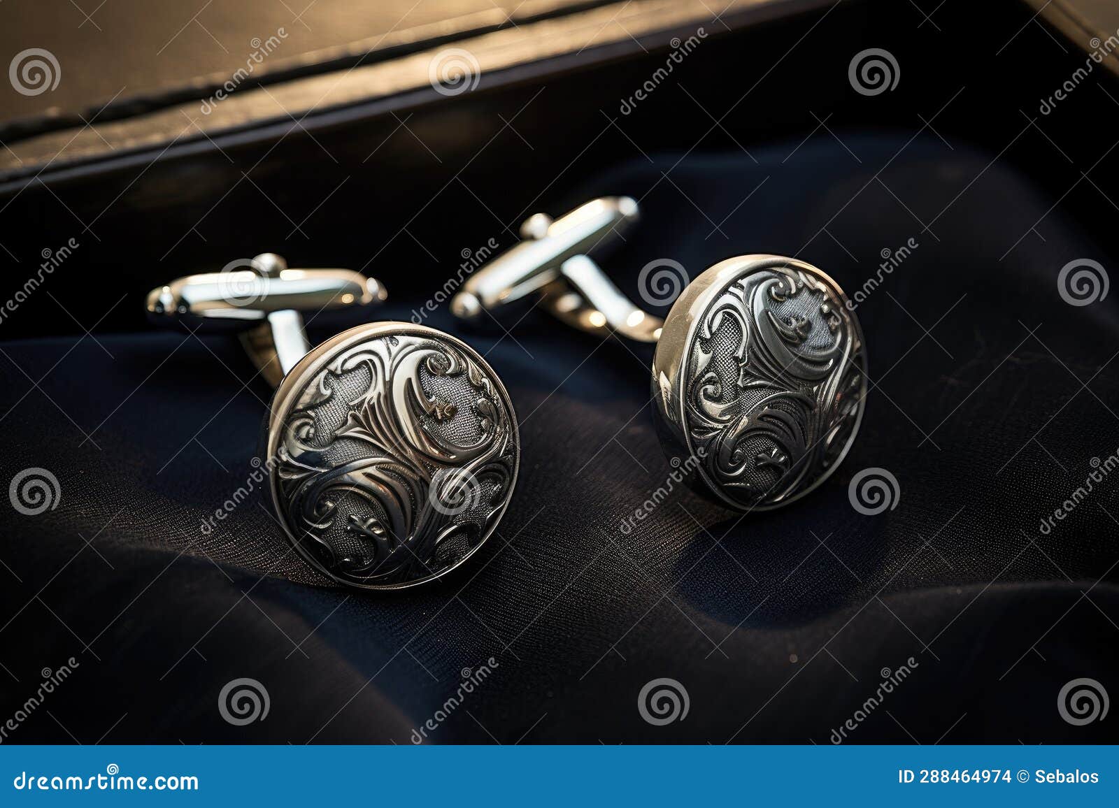 A Pair of Silver Cufflinks with a Nice Design, Sitting on a Black Cloth ...