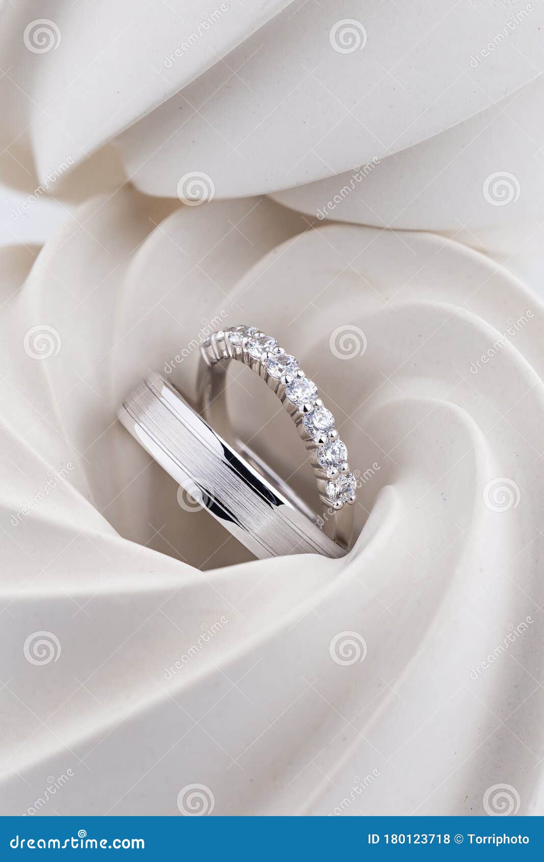 Pair of Silver Wedding Rings with Diamonds and Matte Surface on White ...