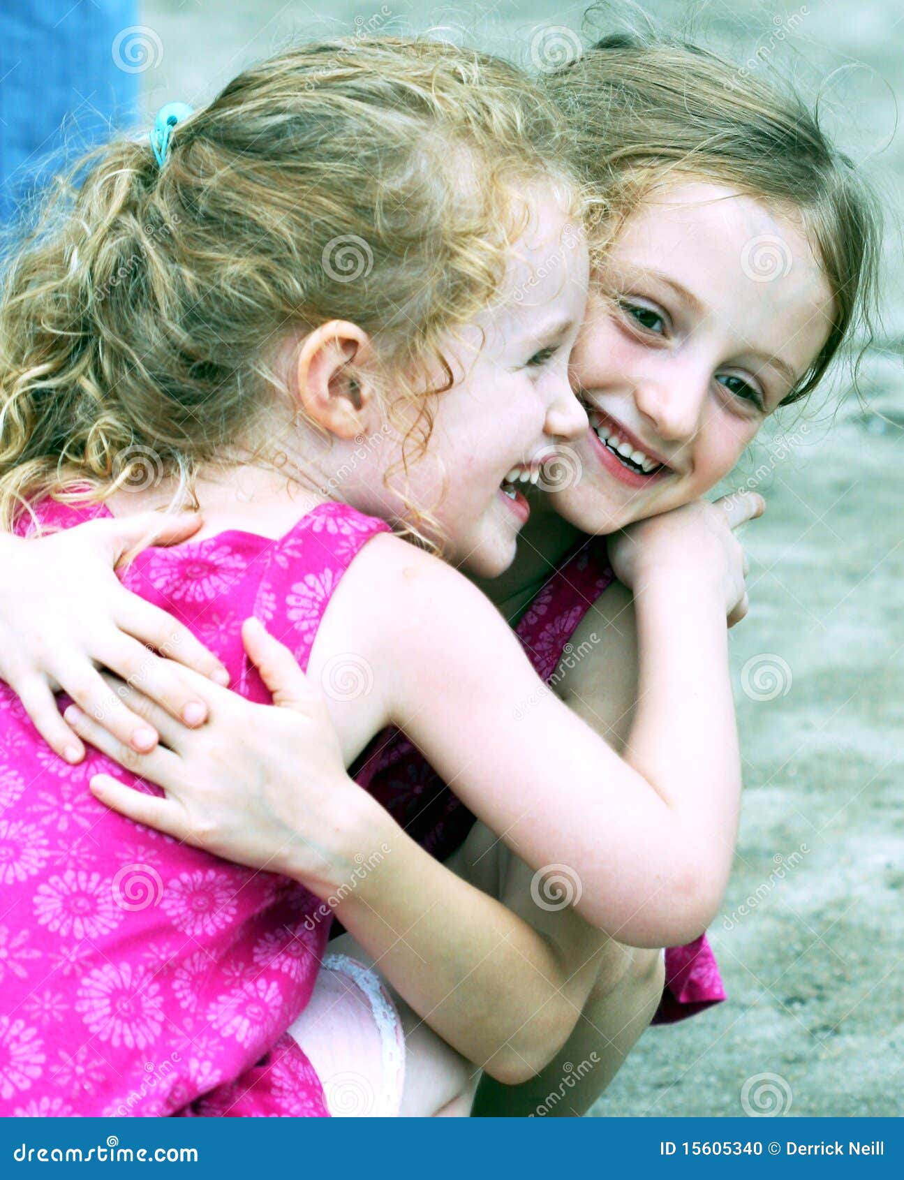 A Pair of Sisters Hug stock photo. Image of happy, giggle - 15605340