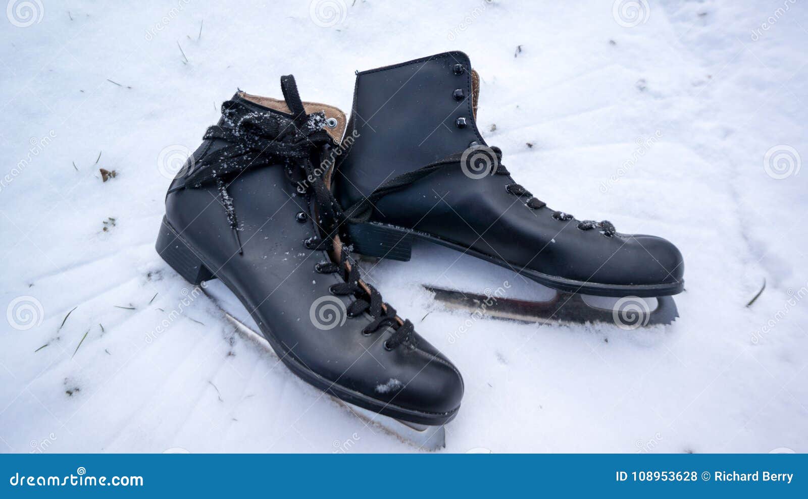Pair of skates in snow stock photo. Image of cold, isolated - 108953628