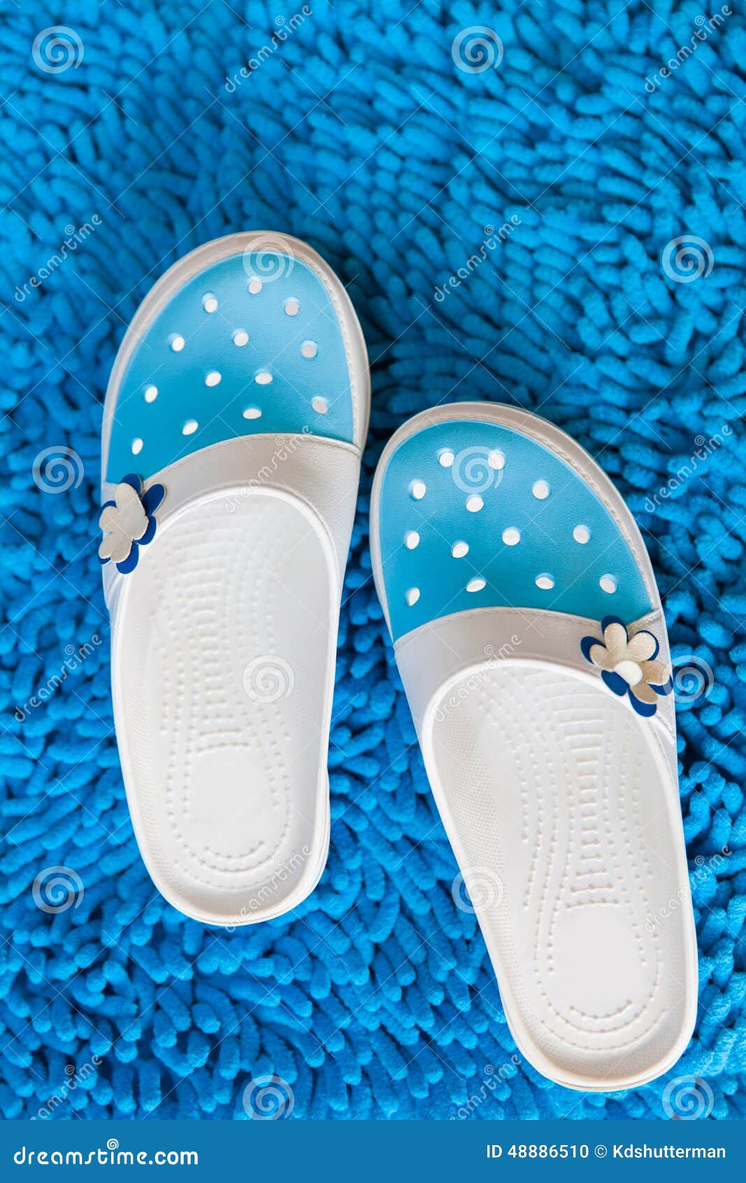 A Pair of Slippers Lay on Rug Stock Photo - Image of slippers ...