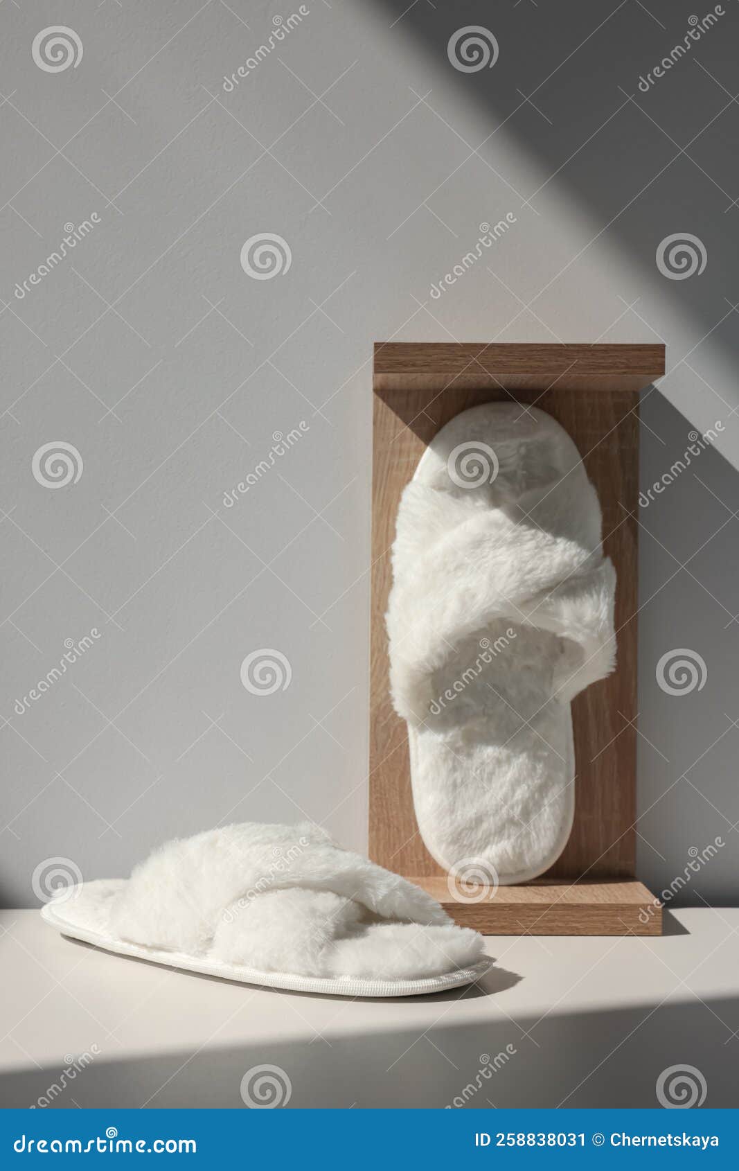 Pair of Soft Slippers and Wooden Stand on Floor Stock Image - Image of ...