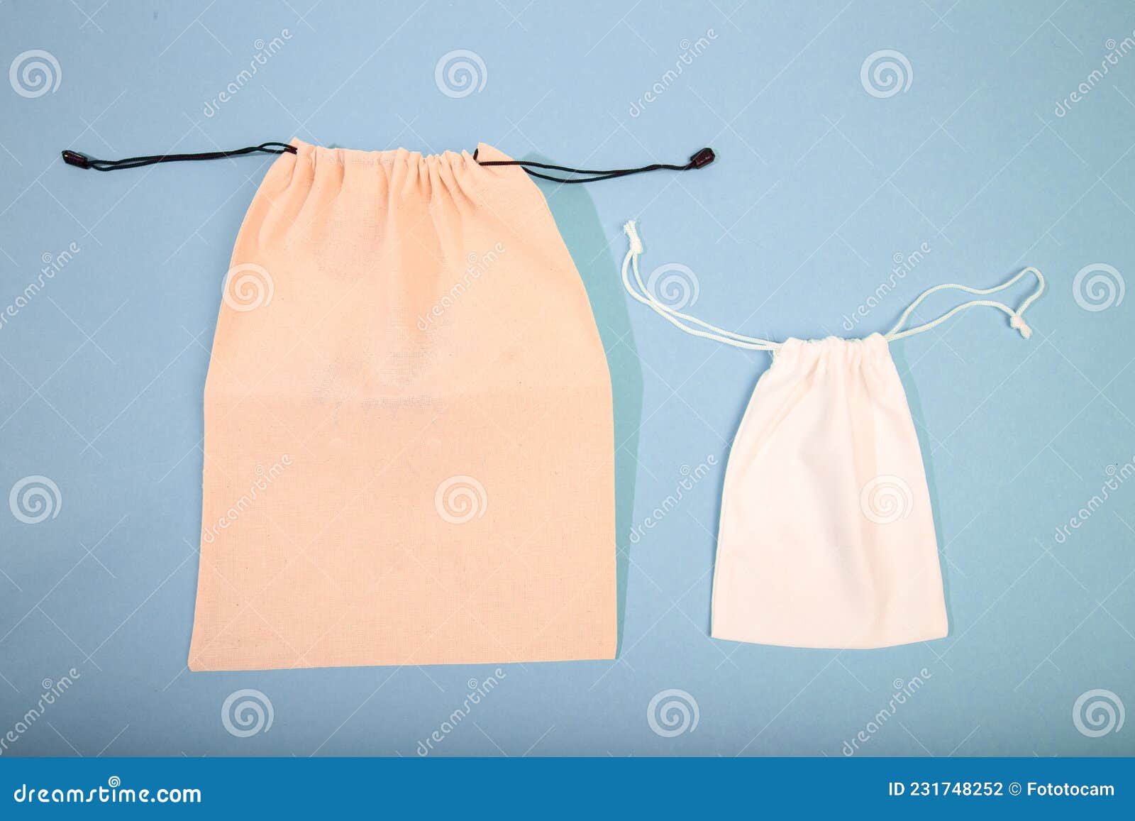 Pair of Textile Fabric Pouches on Blue Background - Image Stock Photo ...