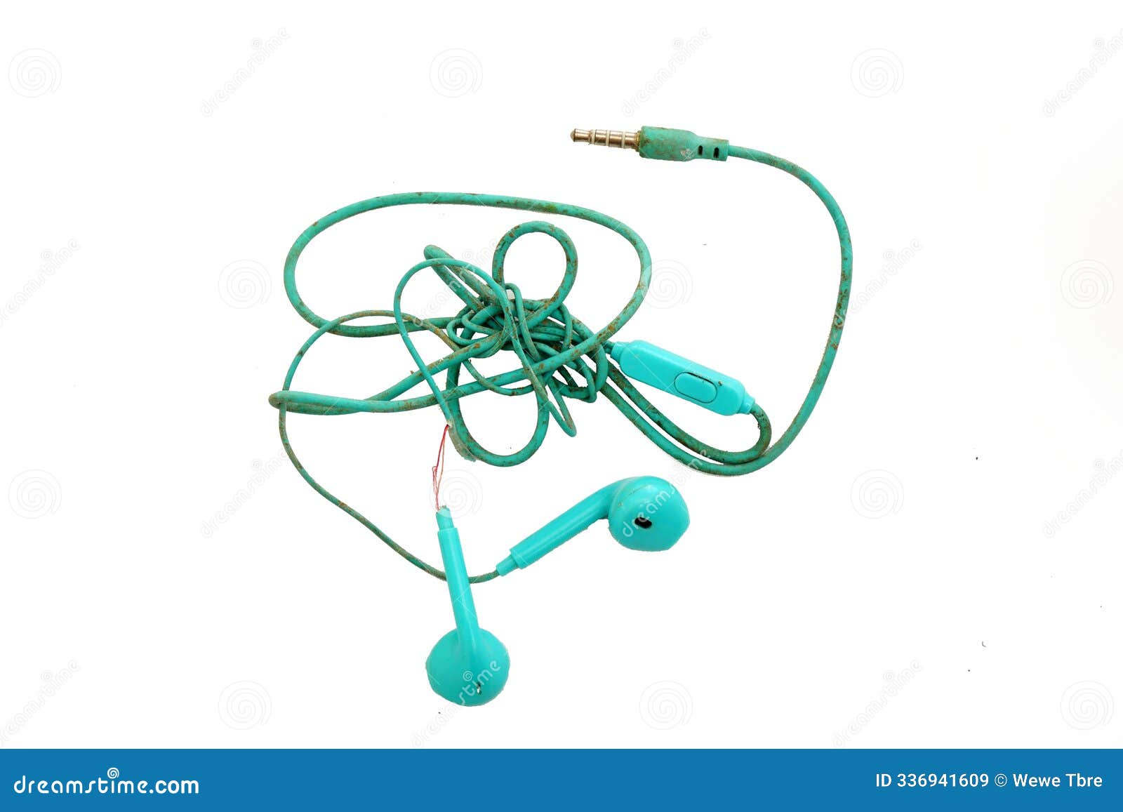 A Pair of Turquoise Earbuds, Crumpled, Worn and Broken, Lying on a ...