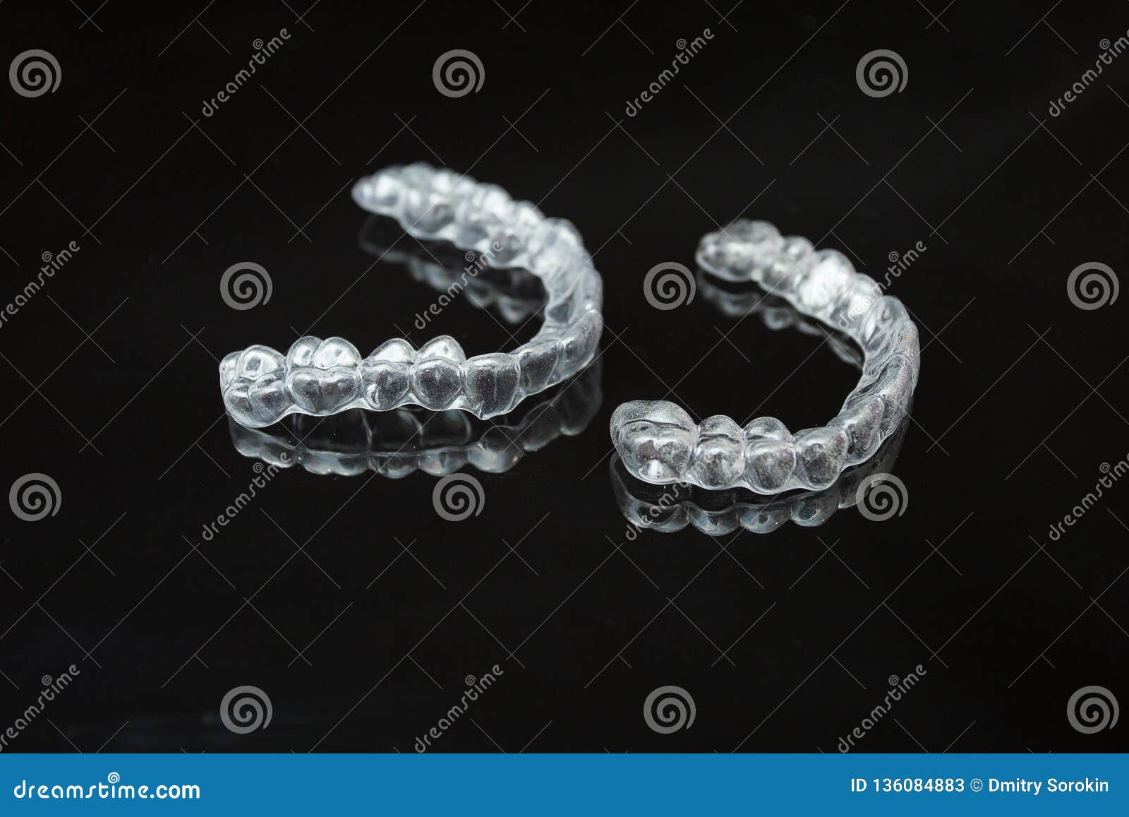 A Pair of Upper and Lower Clear Retainers or Aligners Side by Side on a ...