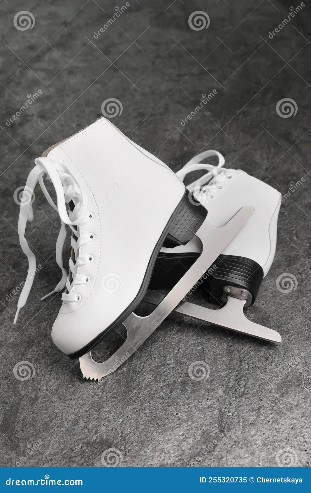 Pair of White Ice Skates on Grey Table Stock Image - Image of boots ...