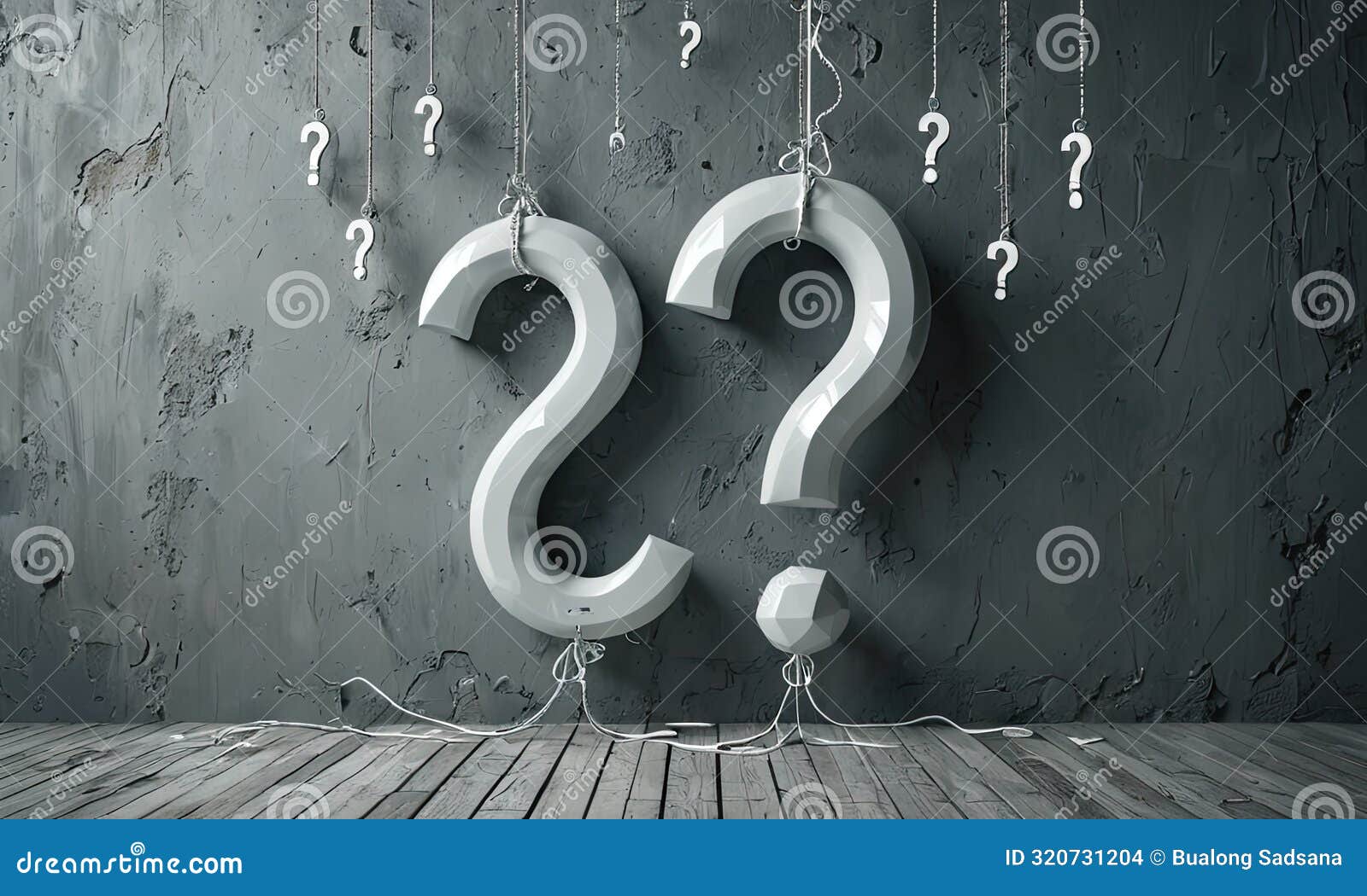 A Pair of White Question Marks are Hanging from a Chain on a Wall ...