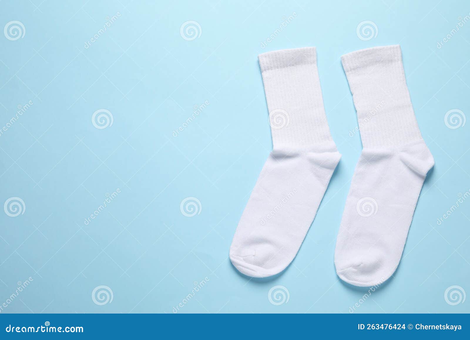 Pair of White Socks on Light Blue Background, Flat Lay. Space for Text ...