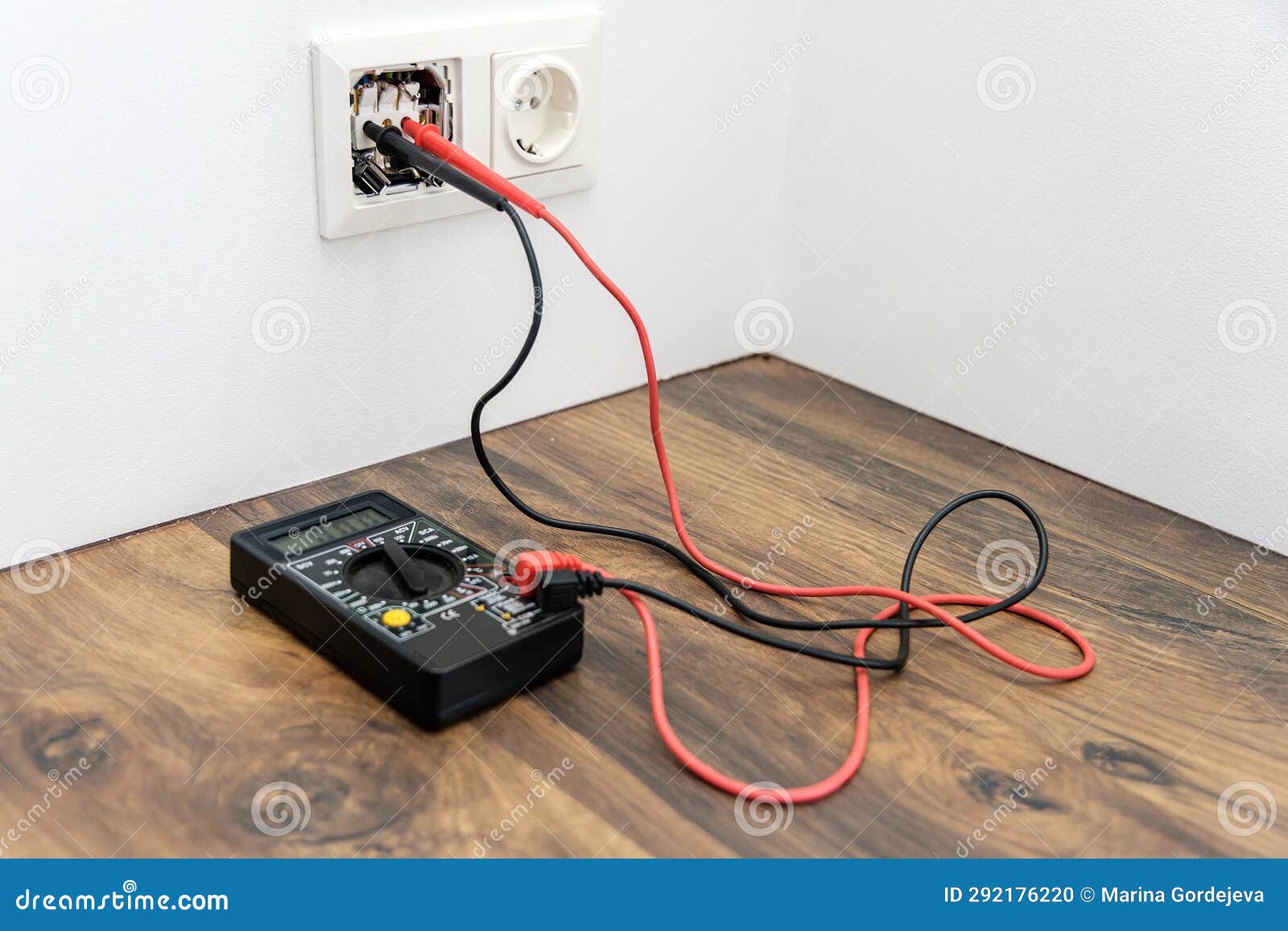 A Pair of Wire Probes are Plugged into the Socket. Multimeter for ...