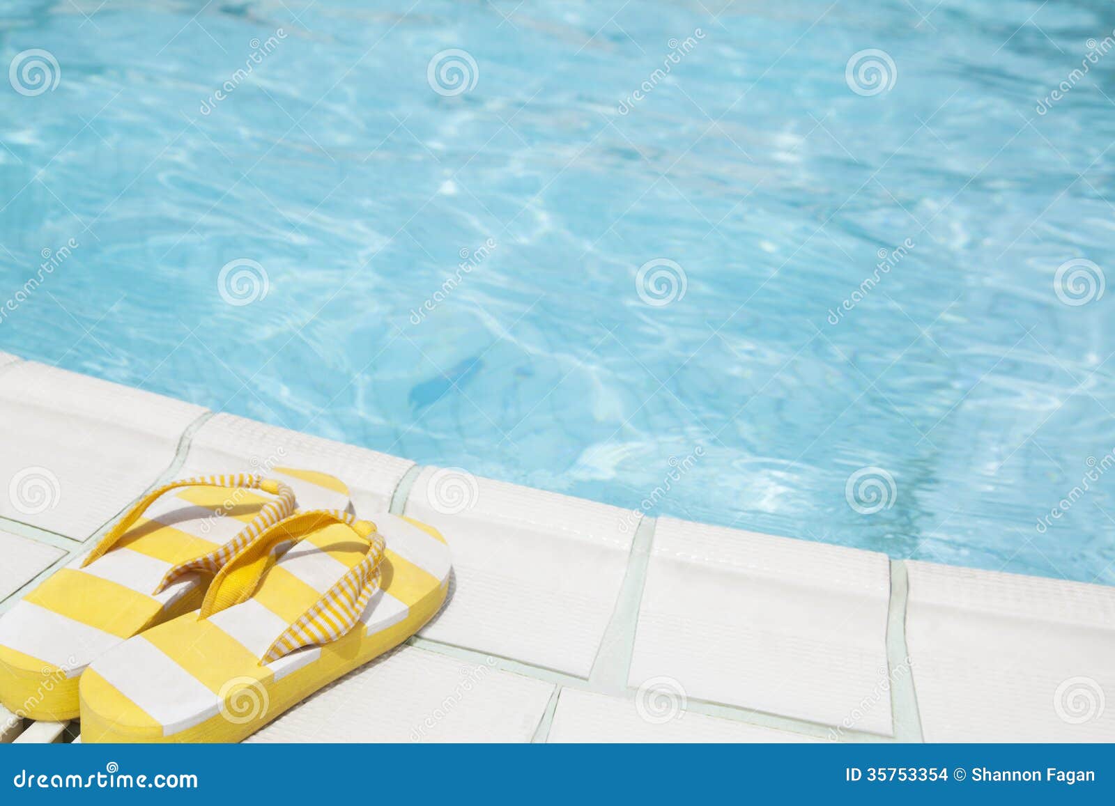 Pair of Yellow Flip Flops by the Pool Side Stock Photo - Image of ...