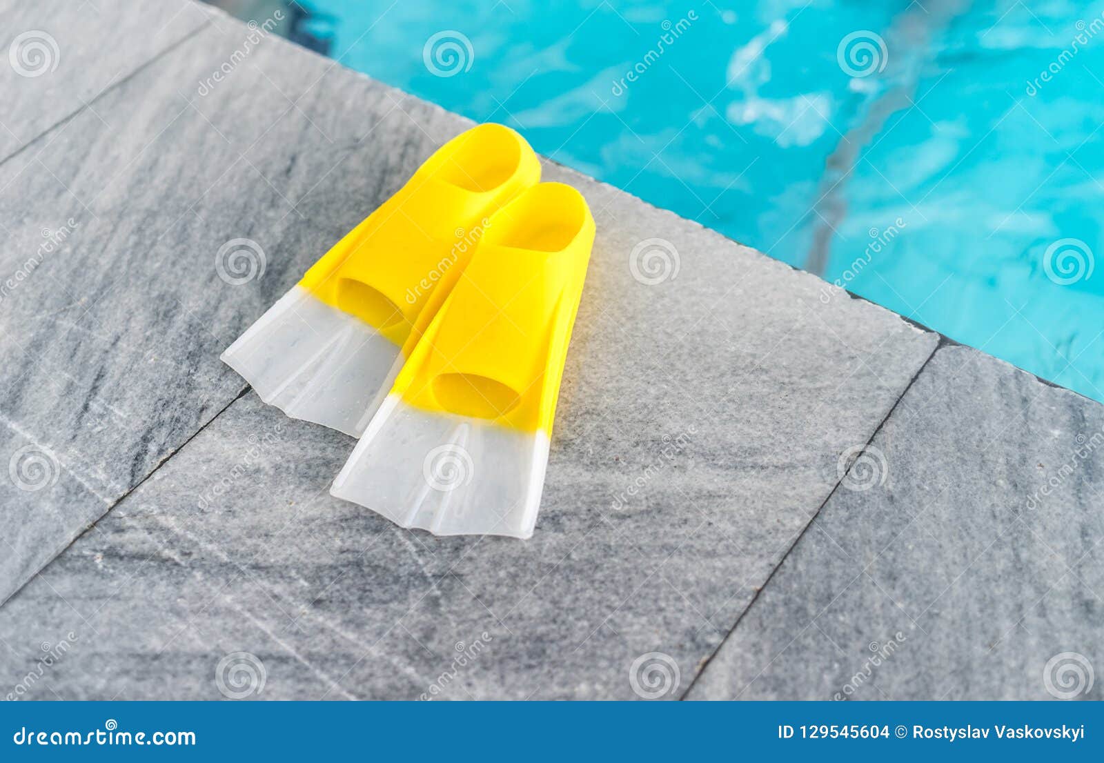 A pair of yellow flippers stock photo. Image of sports - 129545604