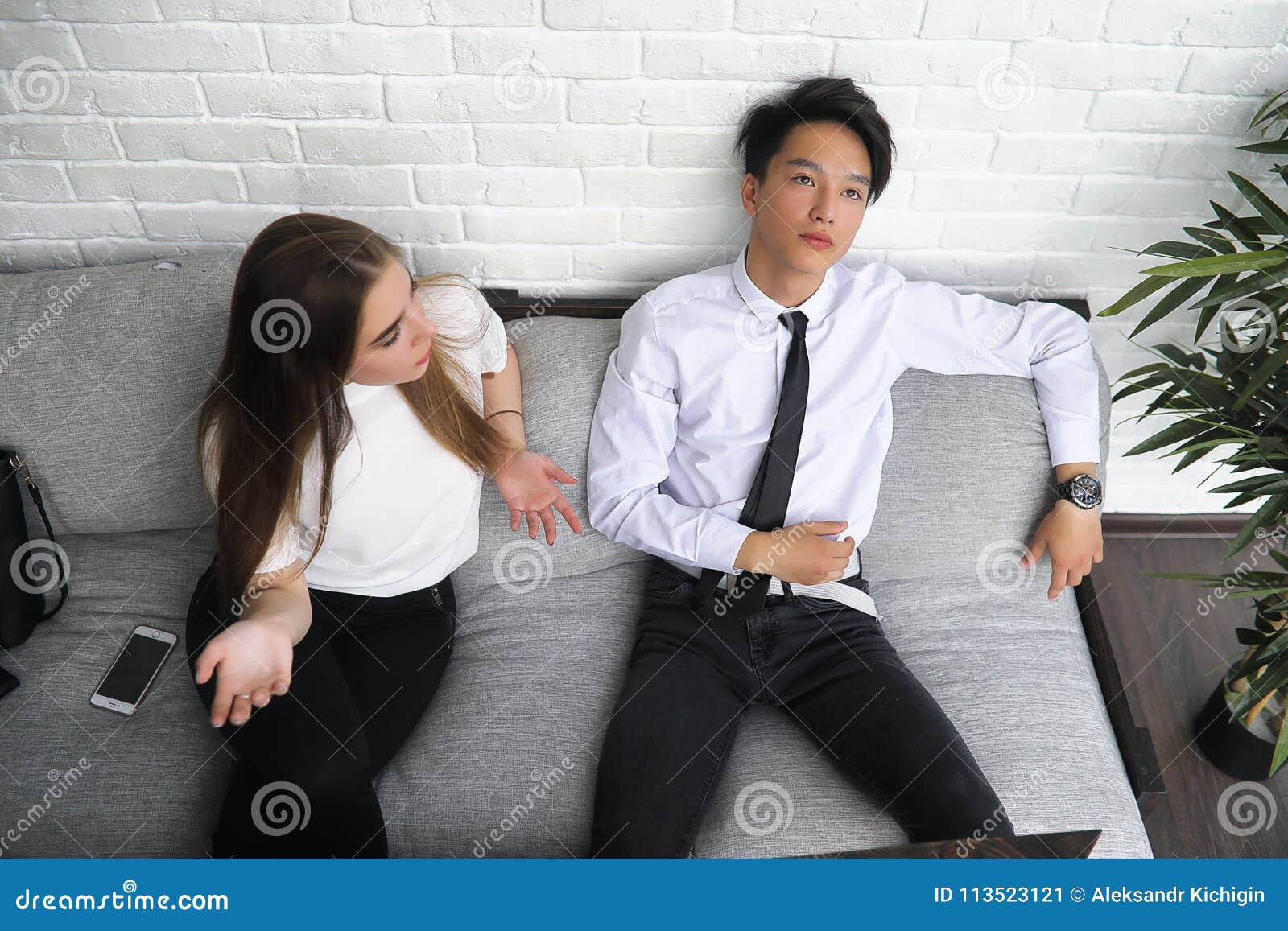 A Pair of Young People Talking at the Office Stock Image - Image of ...