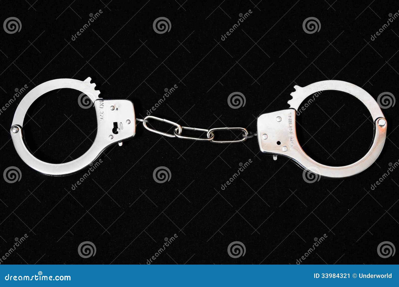 Paires de menottes image stock. Image du objet, blocage - 33984321