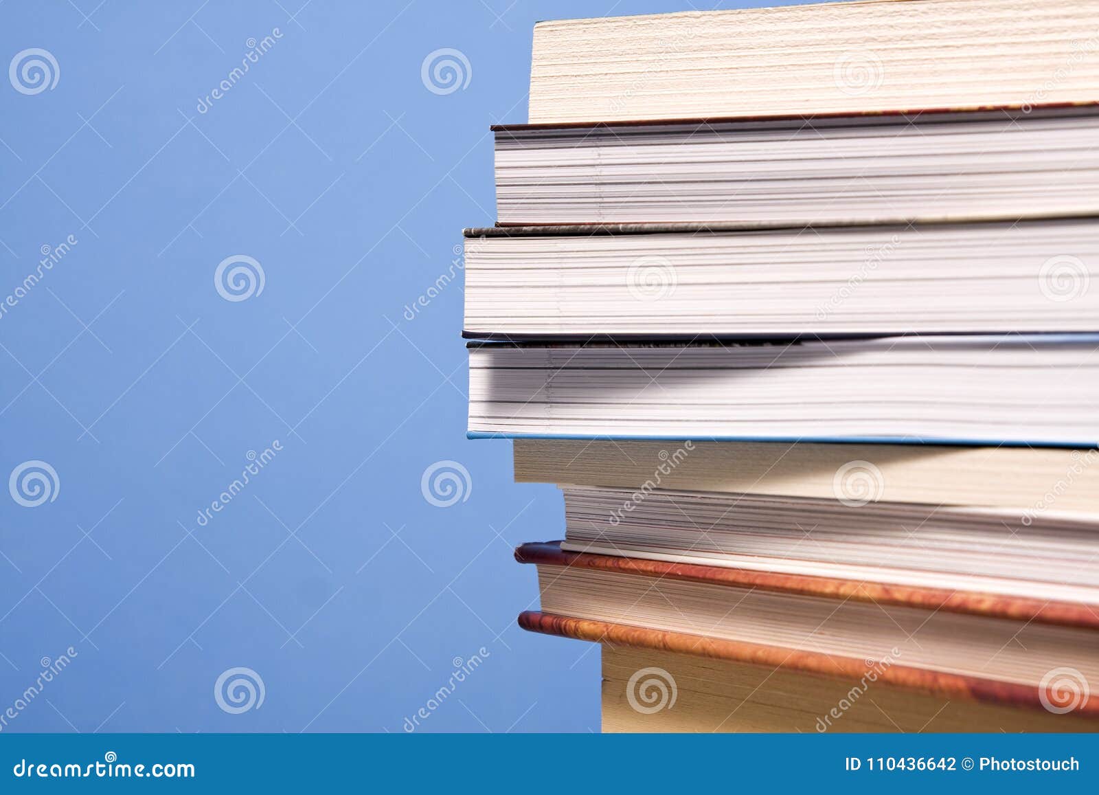 Pale of books on blue wall stock photo. Image of literature - 110436642