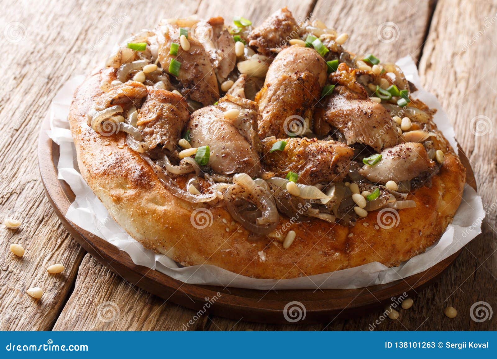 Palestinian Dish of Chicken with Sumac, Pine Nuts and Onions on a Flat ...
