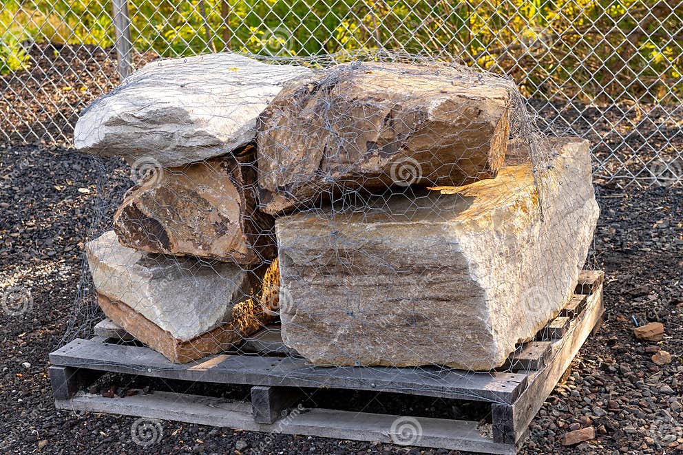 Pallet with large stones stock photo. Image of piled - 302774756