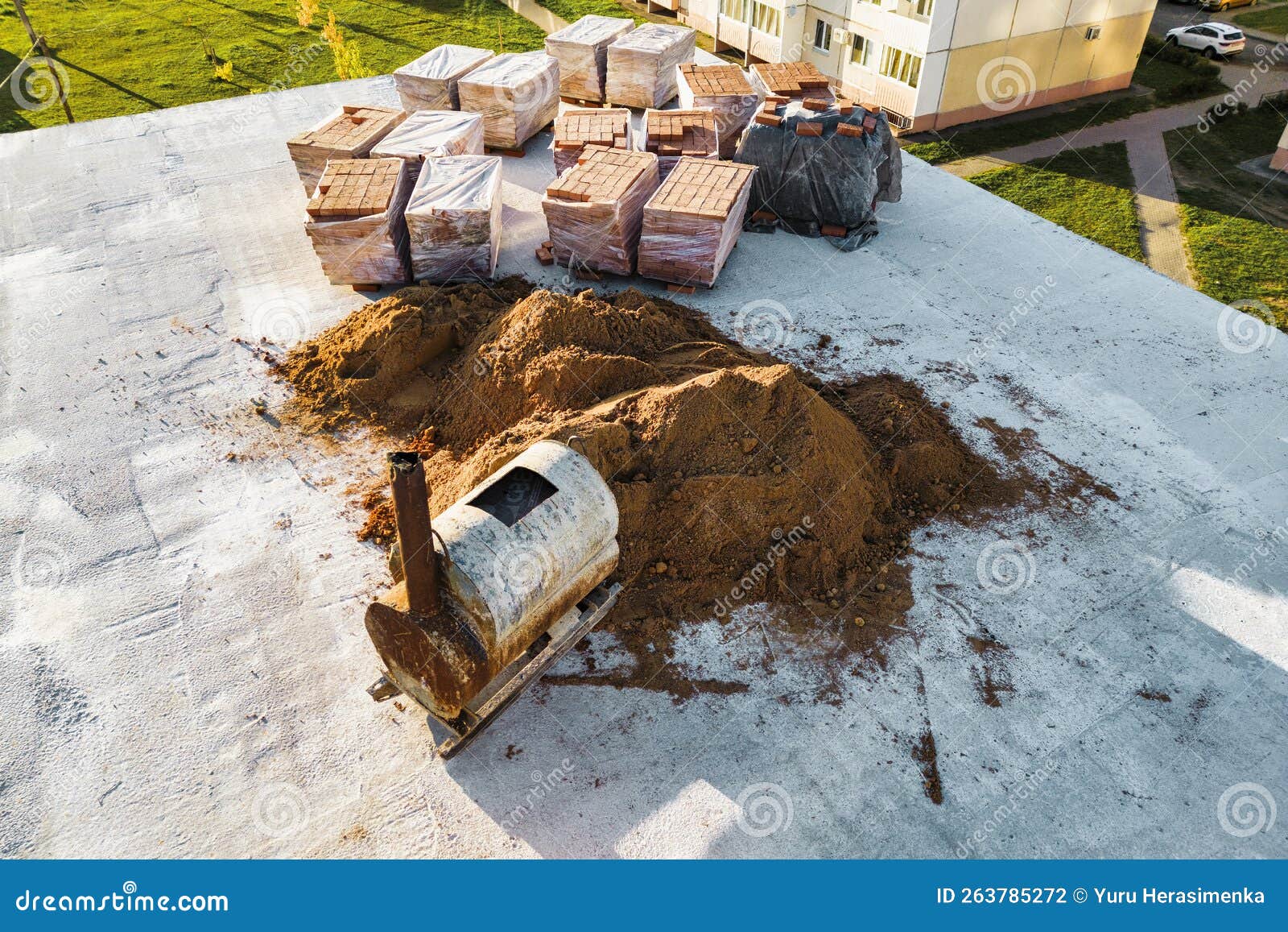 Pallets with Red Ceramic Bricks on the Roof of a Building Under ...