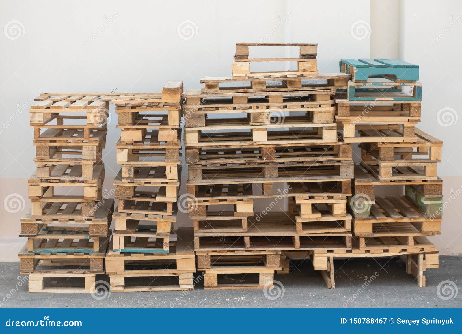 Pallets Stacked on Top of Each Other on the Ground and Against a White ...