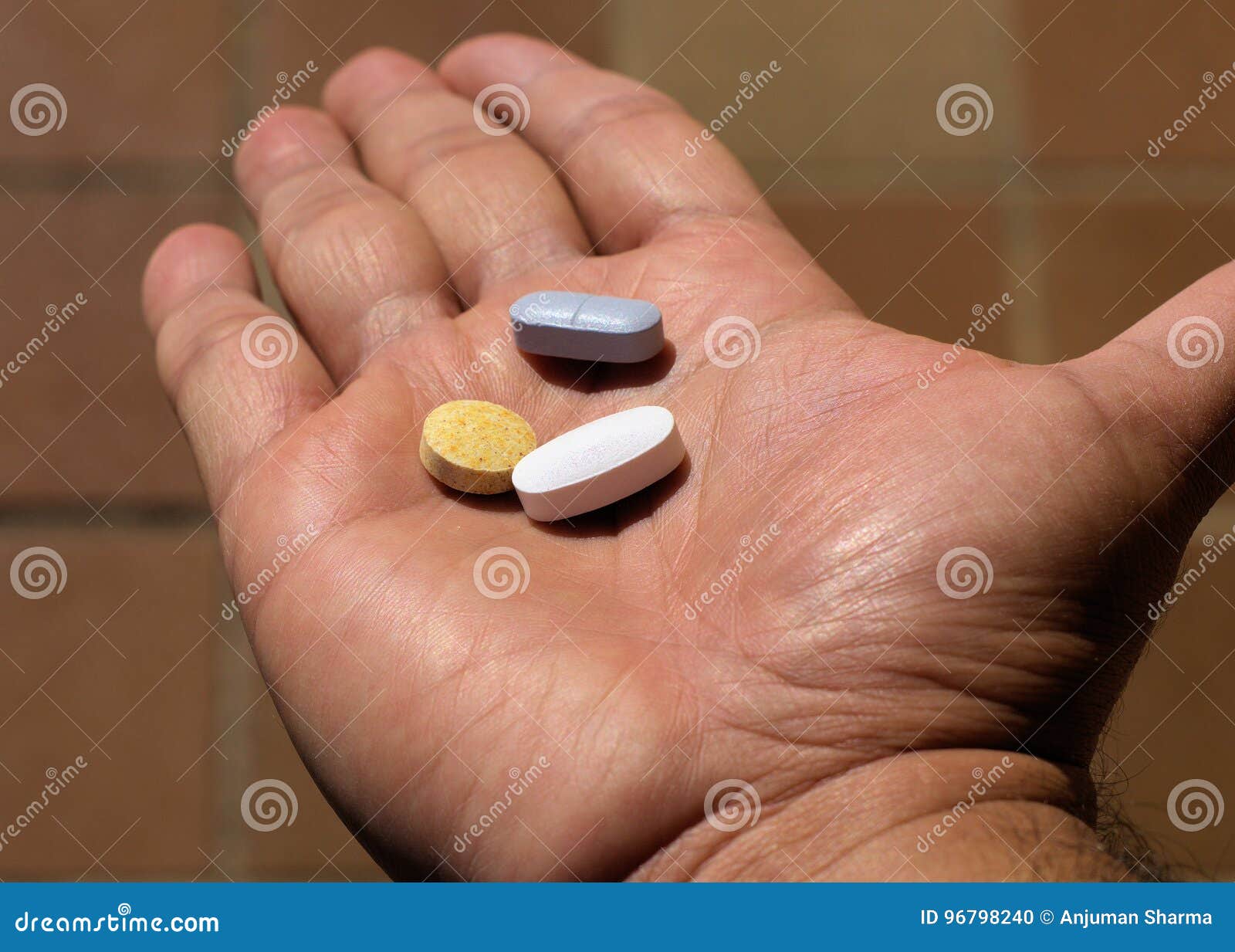 Palm of Hand with Drug Pills or Medicine Tablets Stock Photo - Image of ...