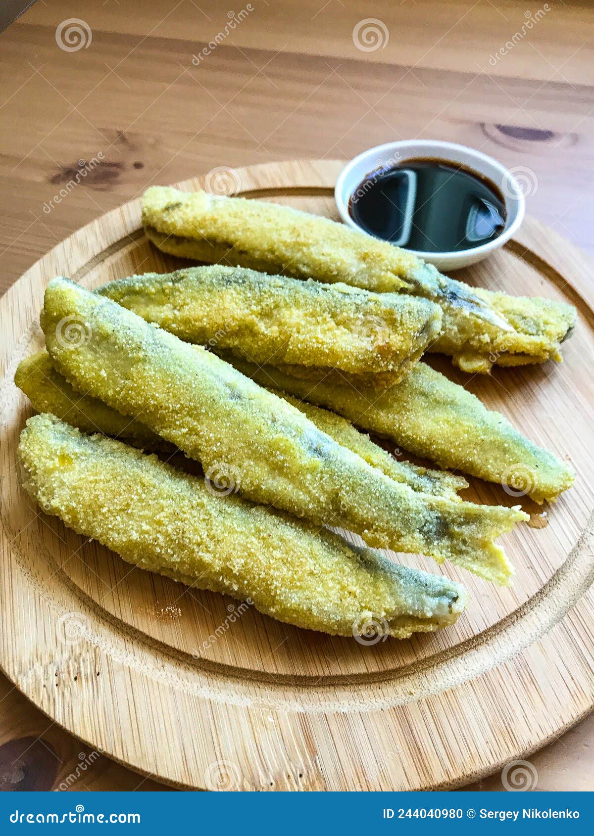 Pan Fried Fish on a Plate. Capelin Fried in Oil with Crispy Breading ...