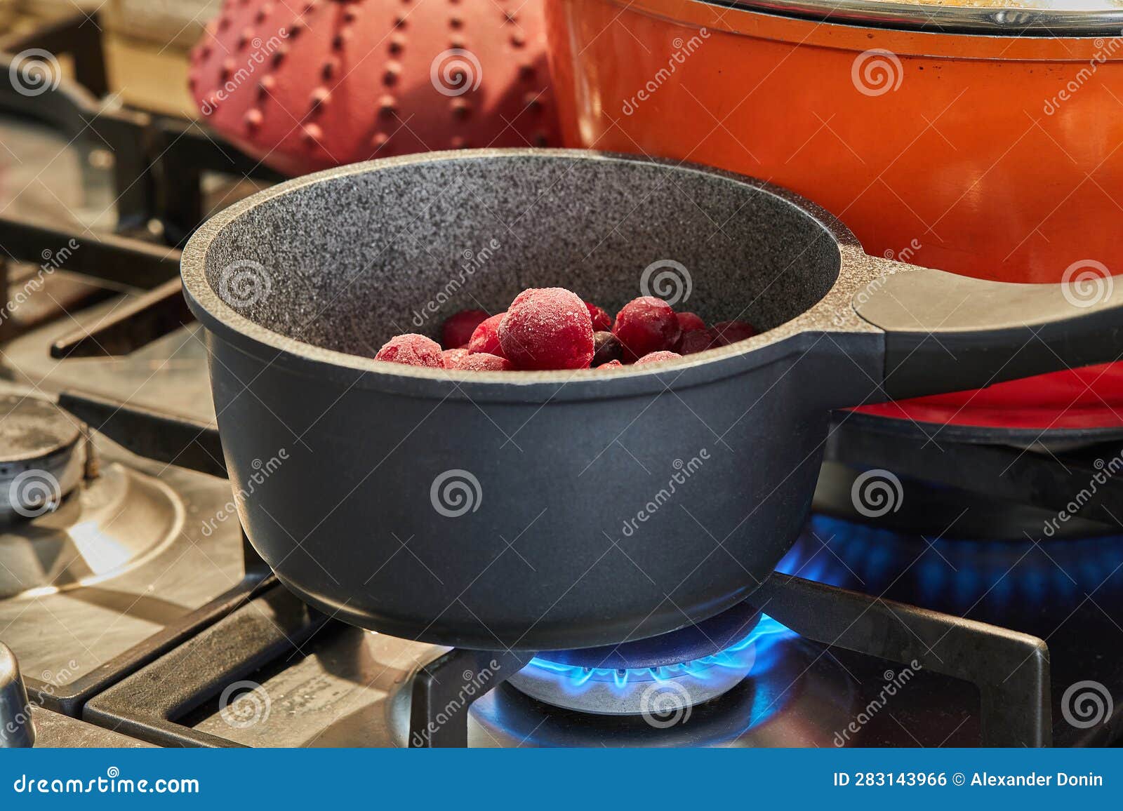 Pan with Frozen Berries on Fire on Gas Stove Stock Photo - Image of ...