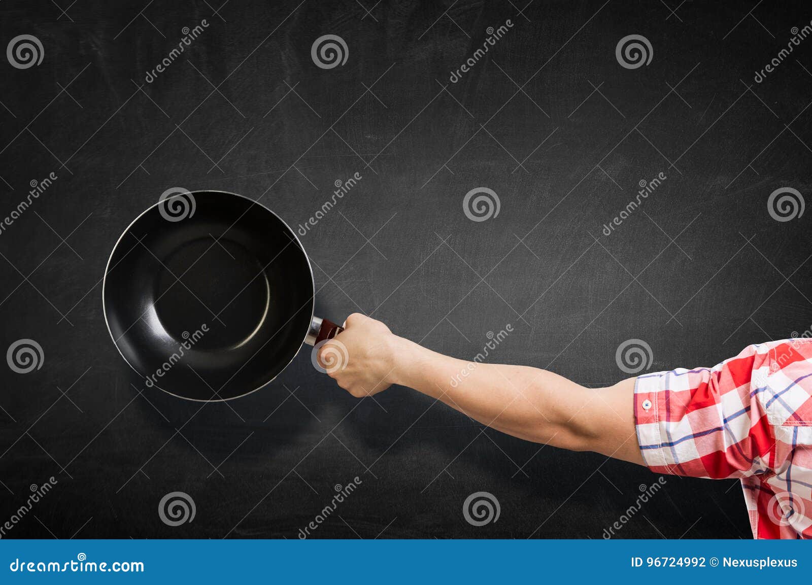 Pan in hand. Mixed media stock photo. Image of meal, iron - 96724992