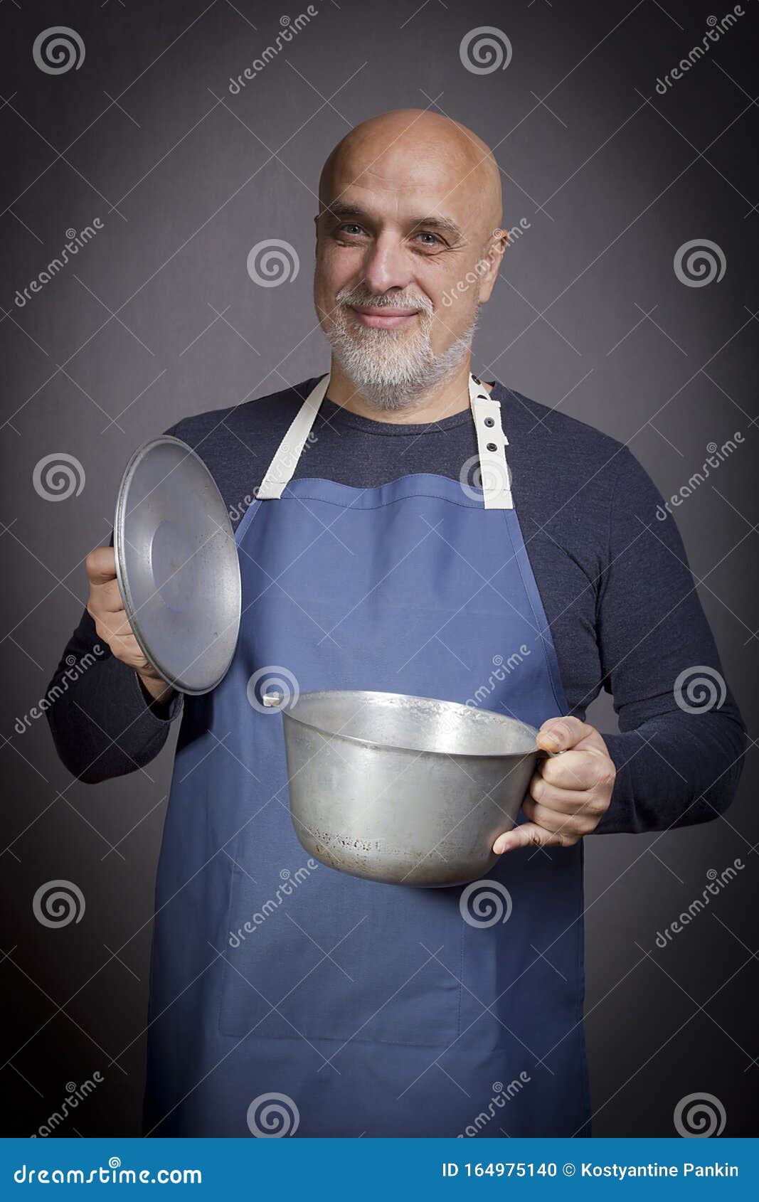 Pan in the hands of a man stock photo. Image of clean - 164975140