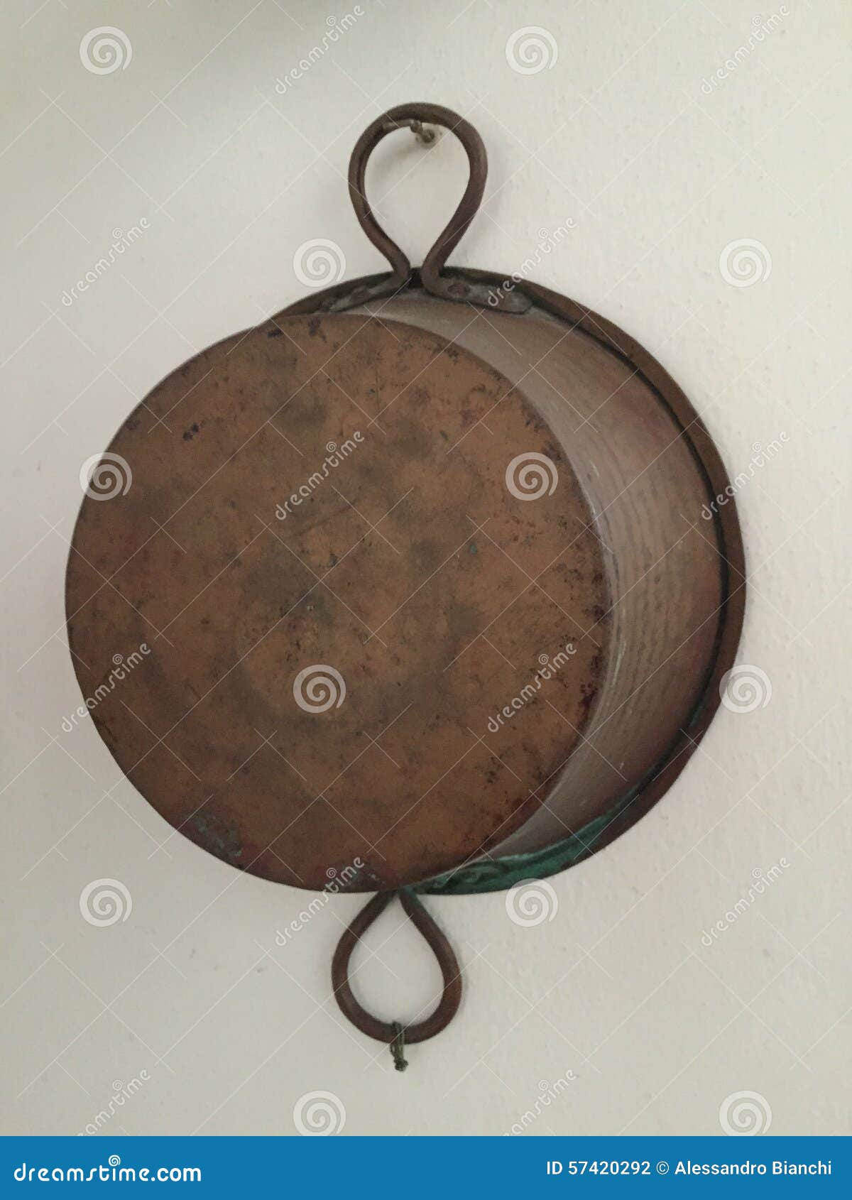 Pan hanging on wall stock photo. Image of antique, handled - 57420292