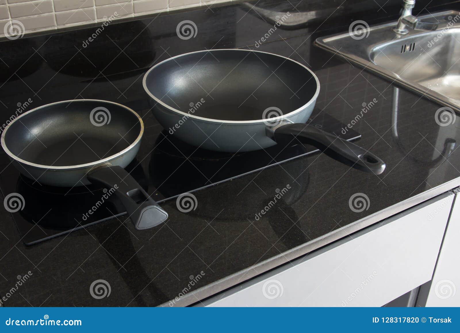 Pan on induction cooker stock photo. Image of modern - 128317820