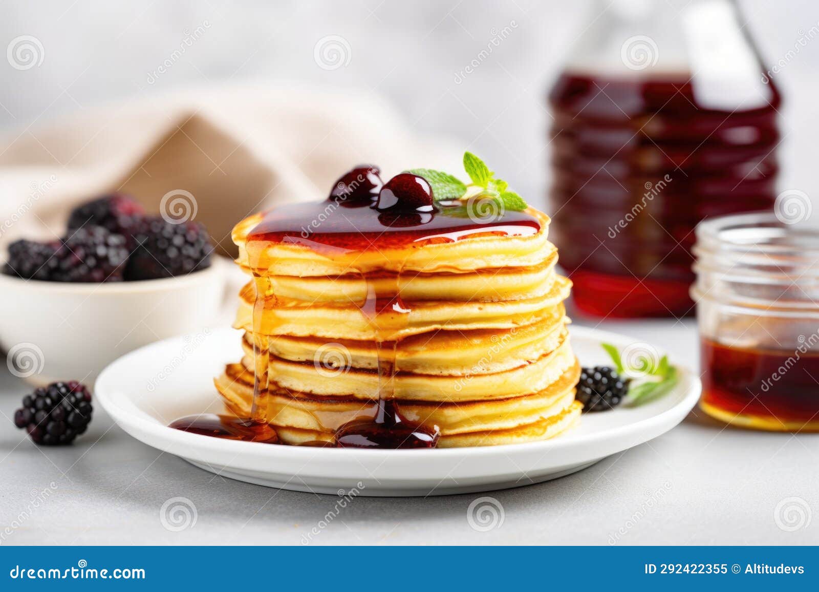 Pancake Stack with a Small Jug of Syrup Tipped Over Next To it Stock ...